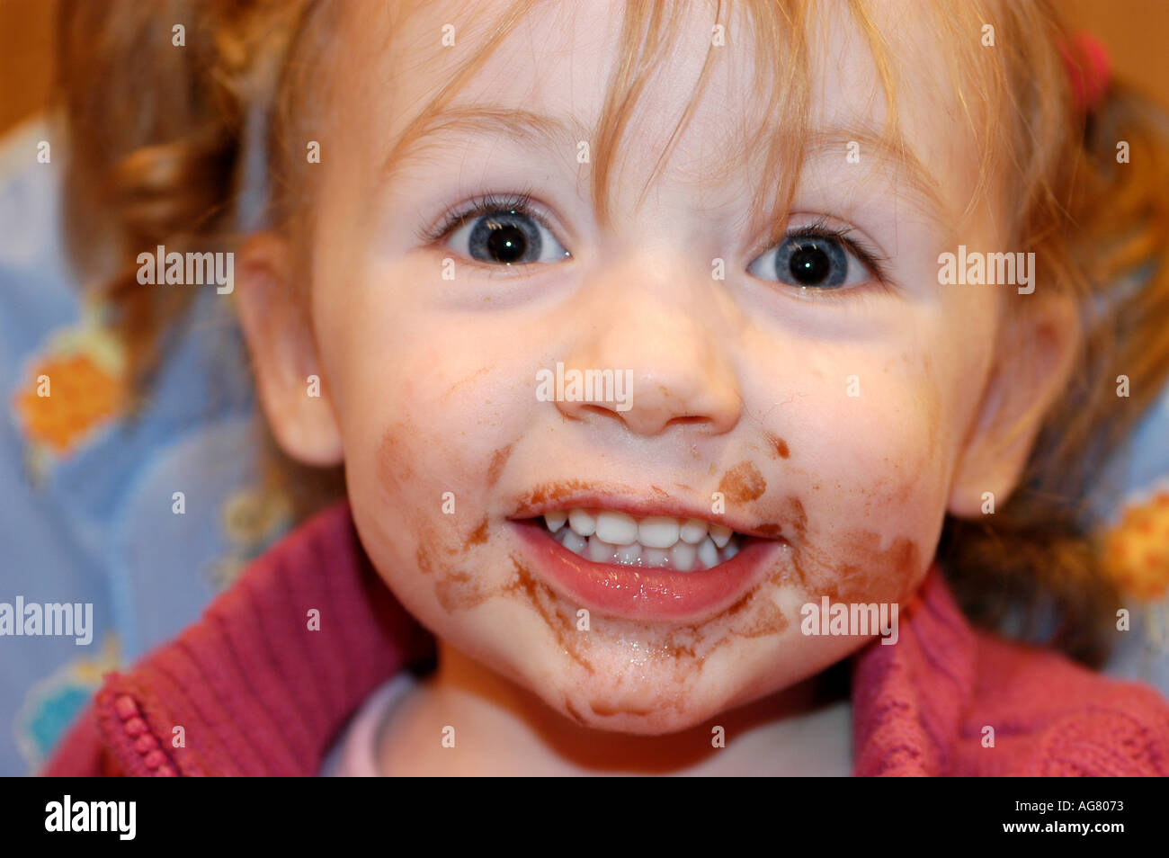 Young girl with chocolate around her face Stock Photo - Alamy