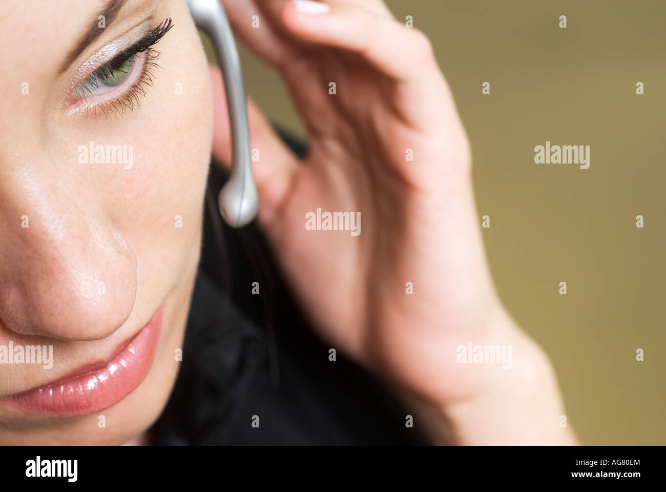Woman using headset Stock Photo - Alamy