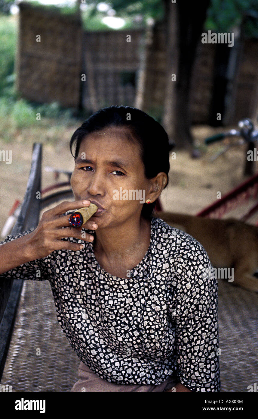Portrait of a Burmese woman smoking her local Cigar Stock Photo - Alamy