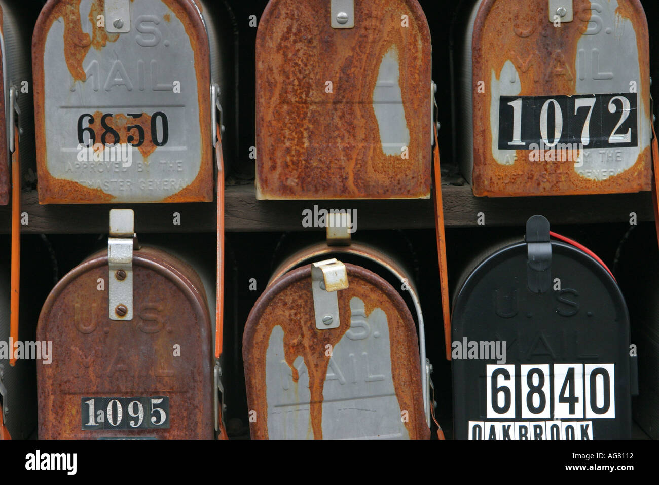 A group of rusty old mailboxes along a highway in Central Oregon Stock ...