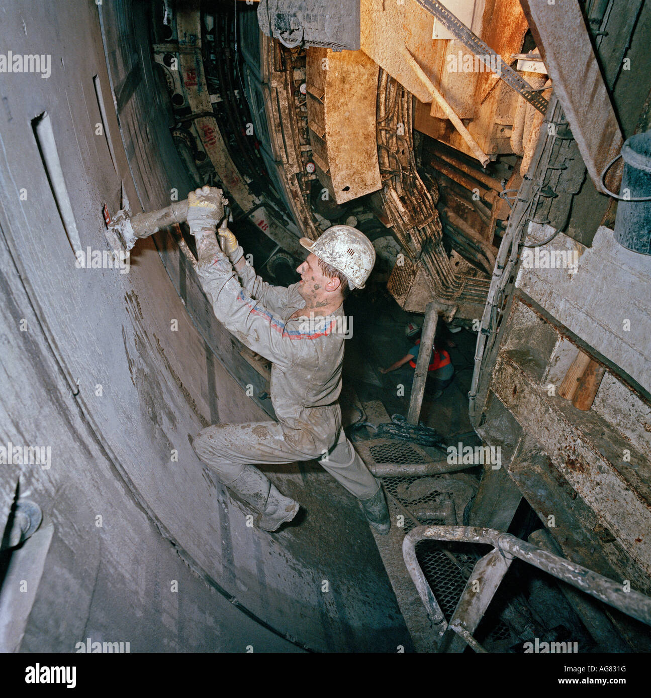Channel Tunnel worker removes grout pipe following grouting operation ...