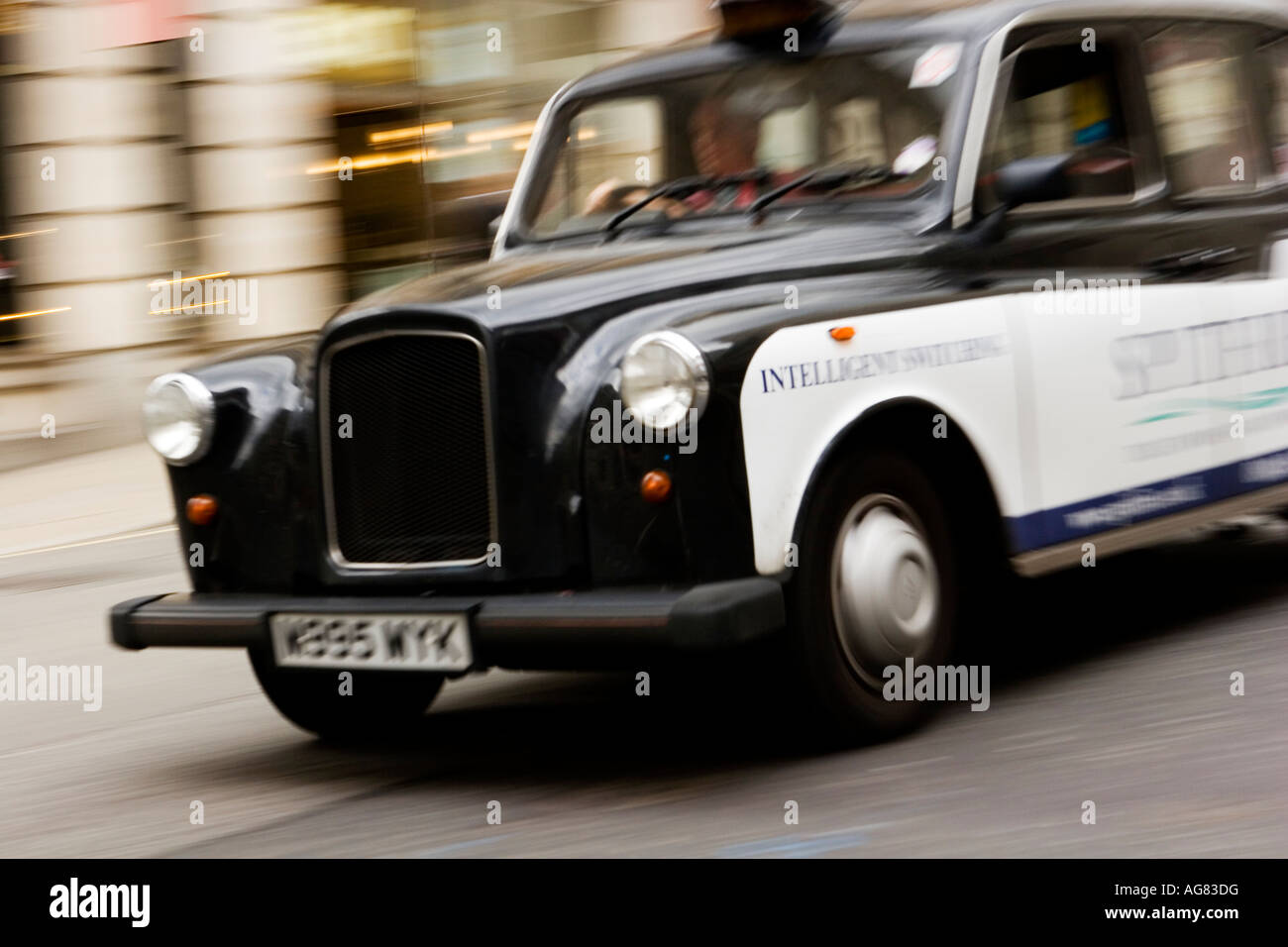 Black cab, London, blurred to show movement Stock Photo - Alamy