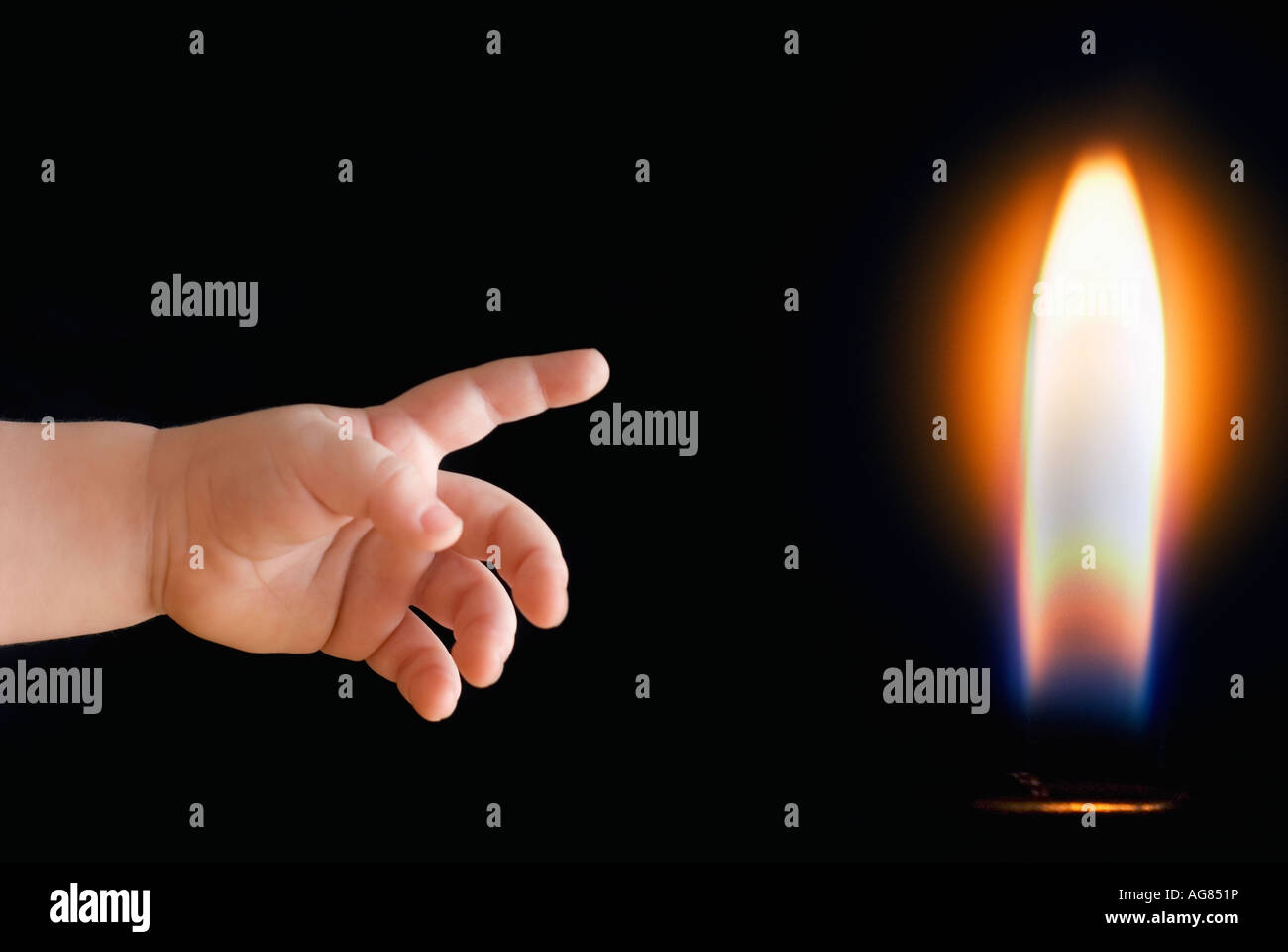 Child reaching for flame Stock Photo - Alamy
