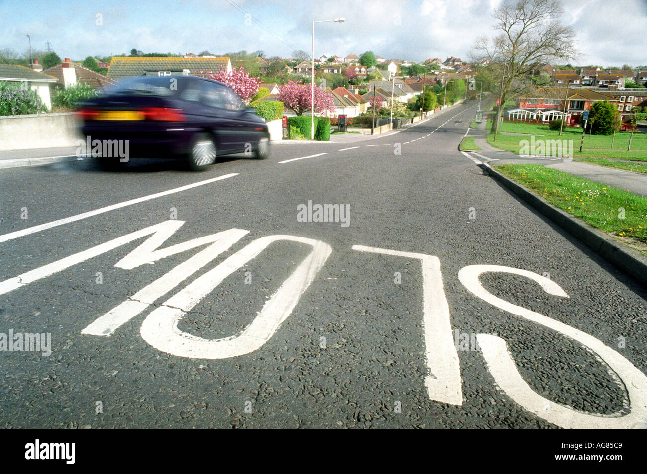 Slow marking on road Stock Photo - Alamy