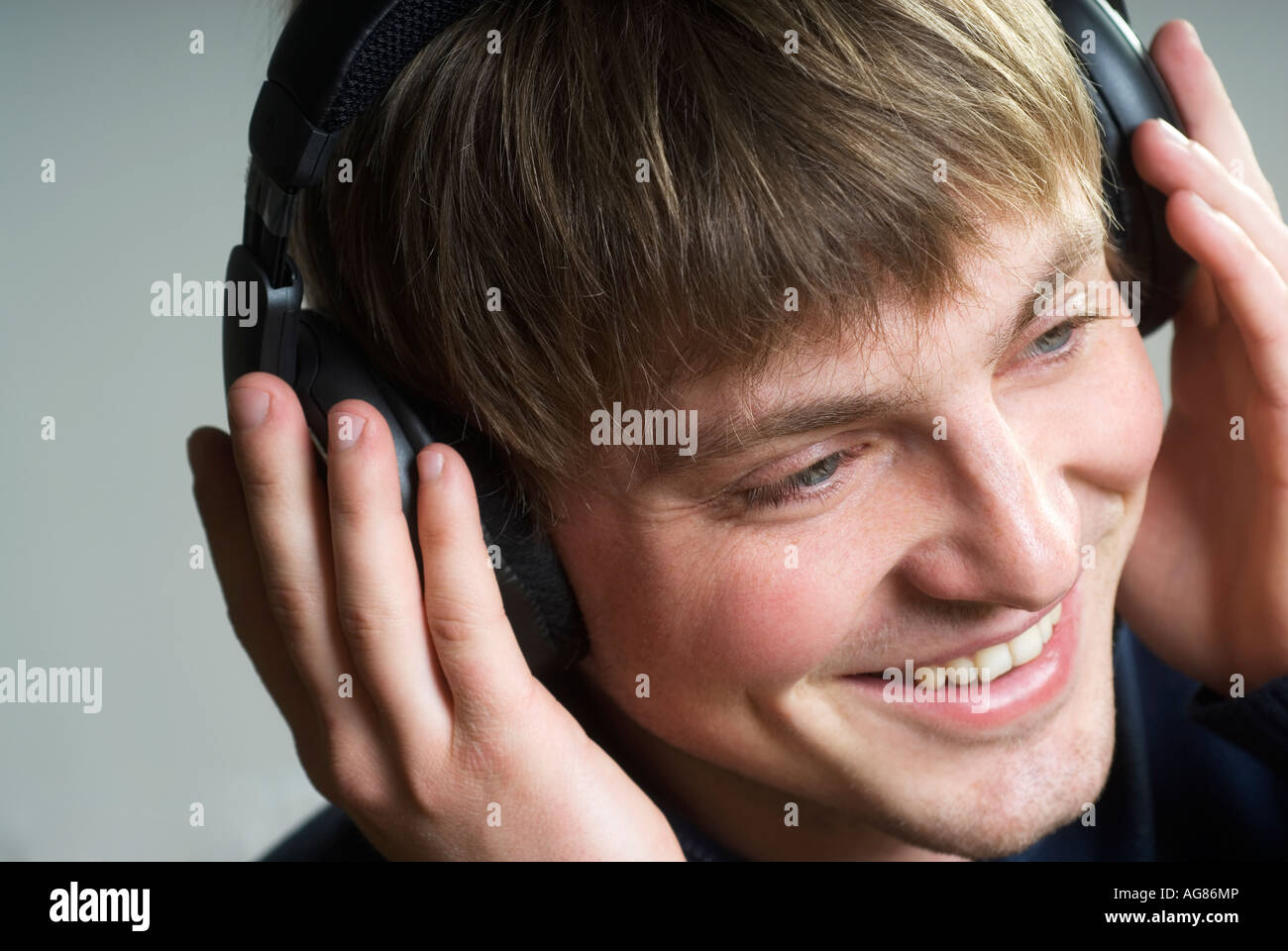 Man using headphones Stock Photo - Alamy