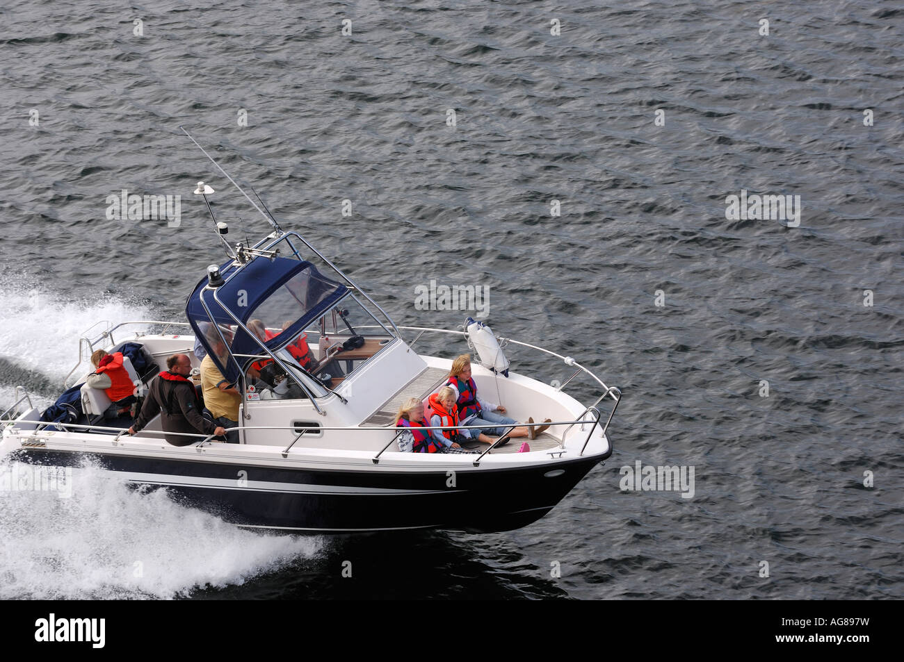 Family trip in a motorboat Stock Photo - Alamy