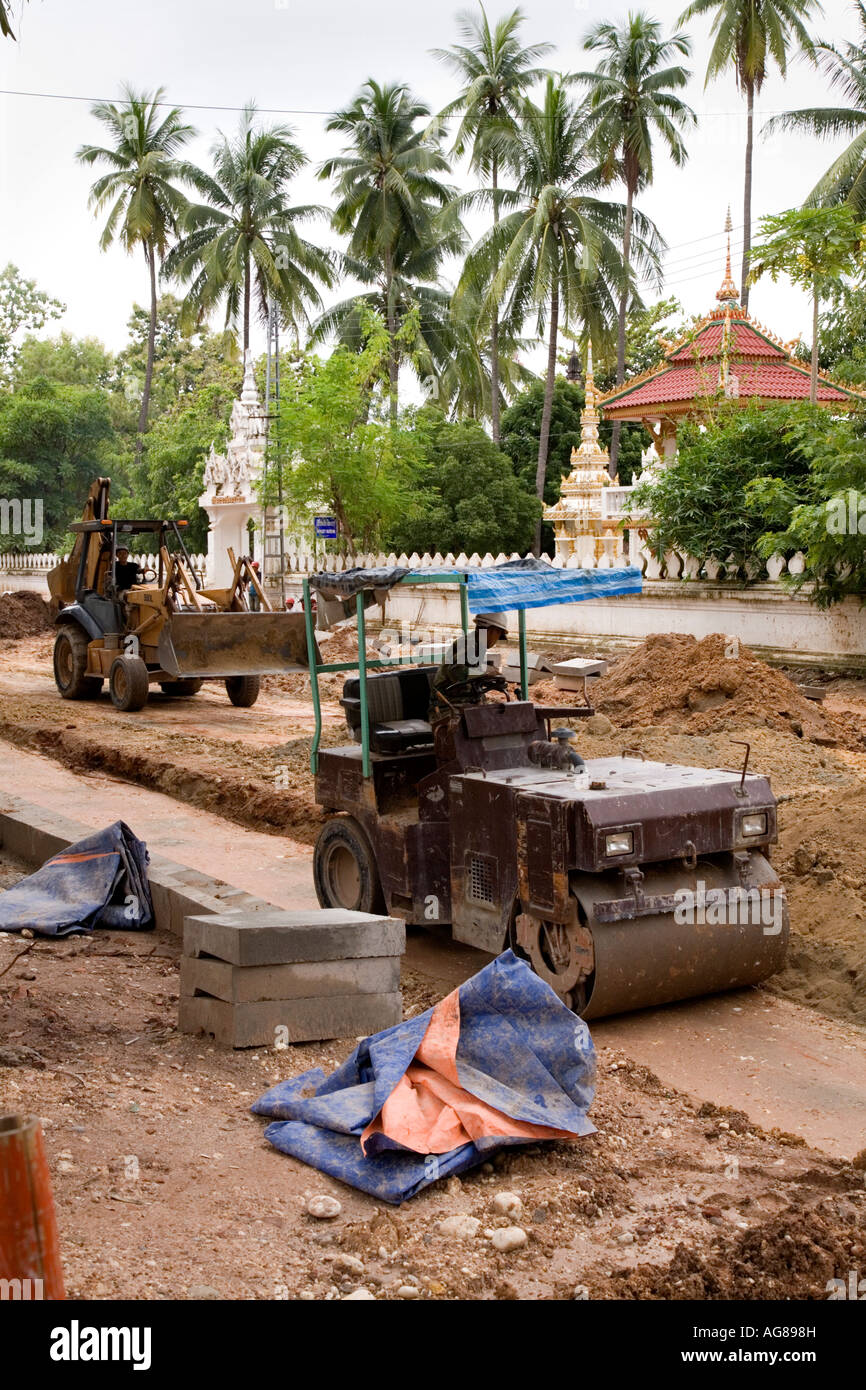 Road construction with workers working on the highway repair in ...
