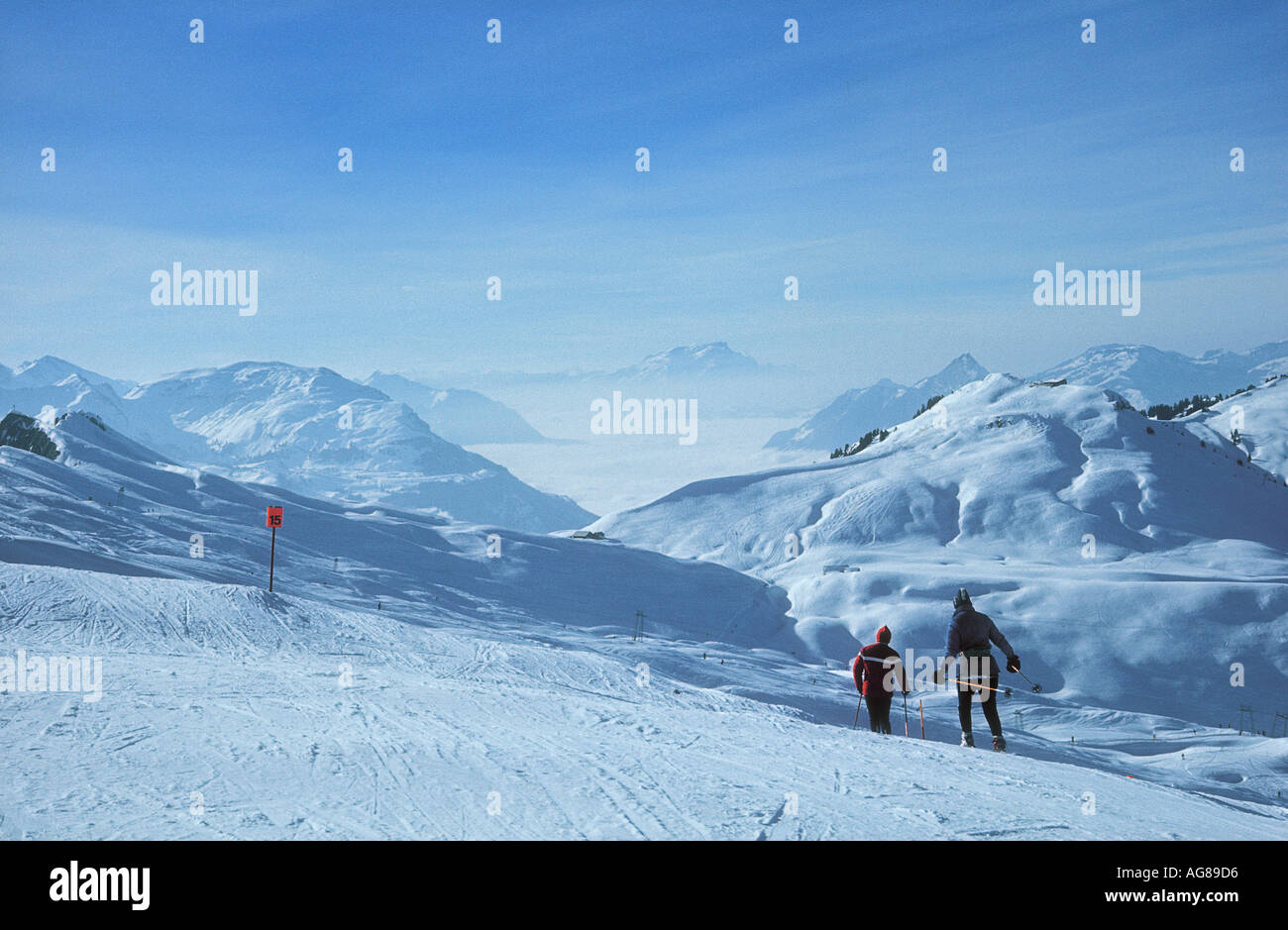 Skiers on a piste high above Einsiedeln in Switzerland Stock Photo - Alamy