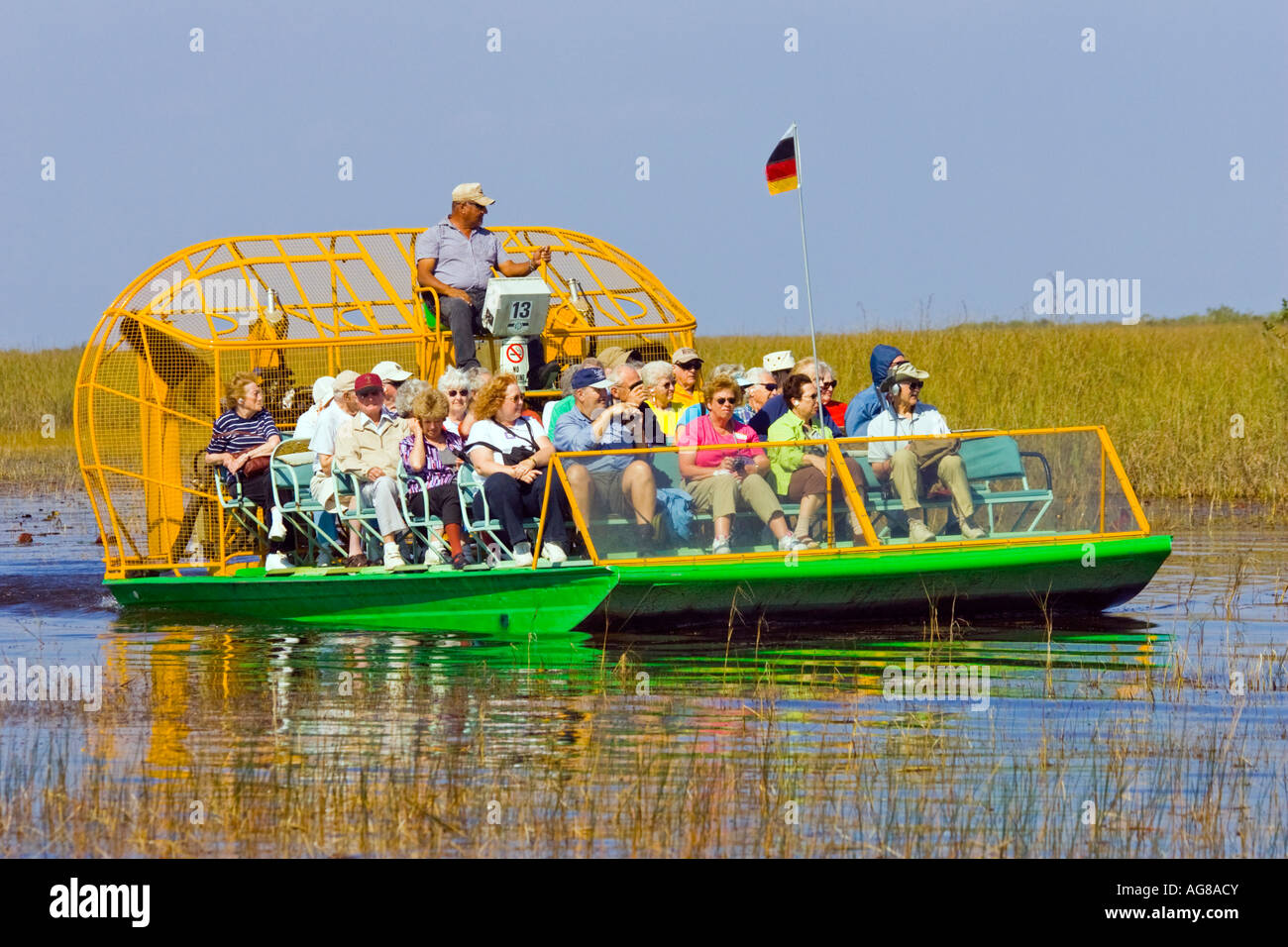 A large airboat sets out from Indian Village, Florida for an Everglades ...