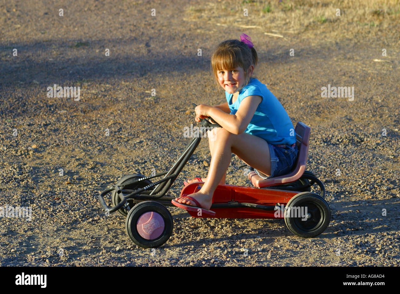 Young girl playing on billy cart South Australia High resolution ...