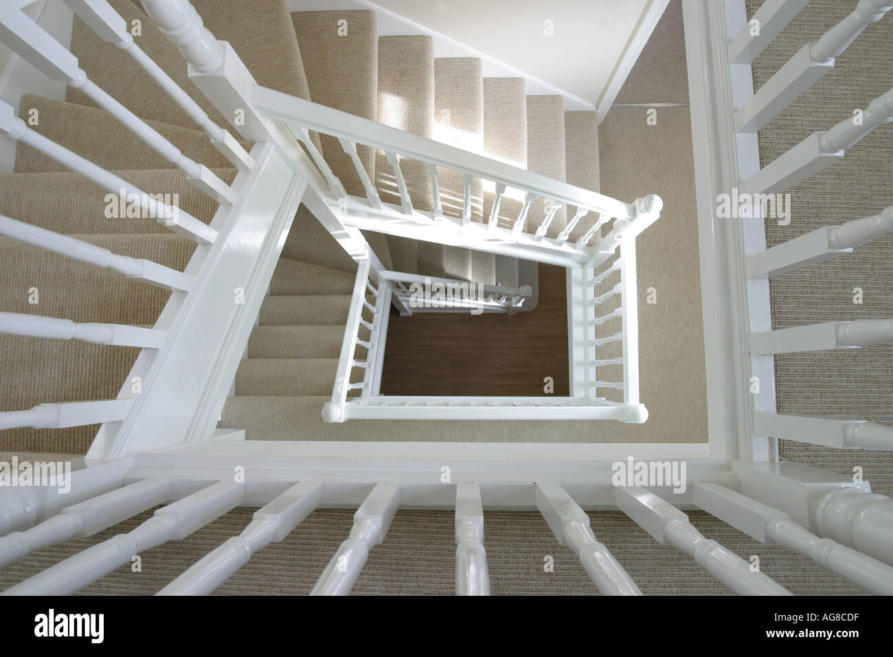 Looking down into a staircase. Several flights of steps stairs. Long ... Looking down into a staircase. Several flights of steps stairs. Long ...