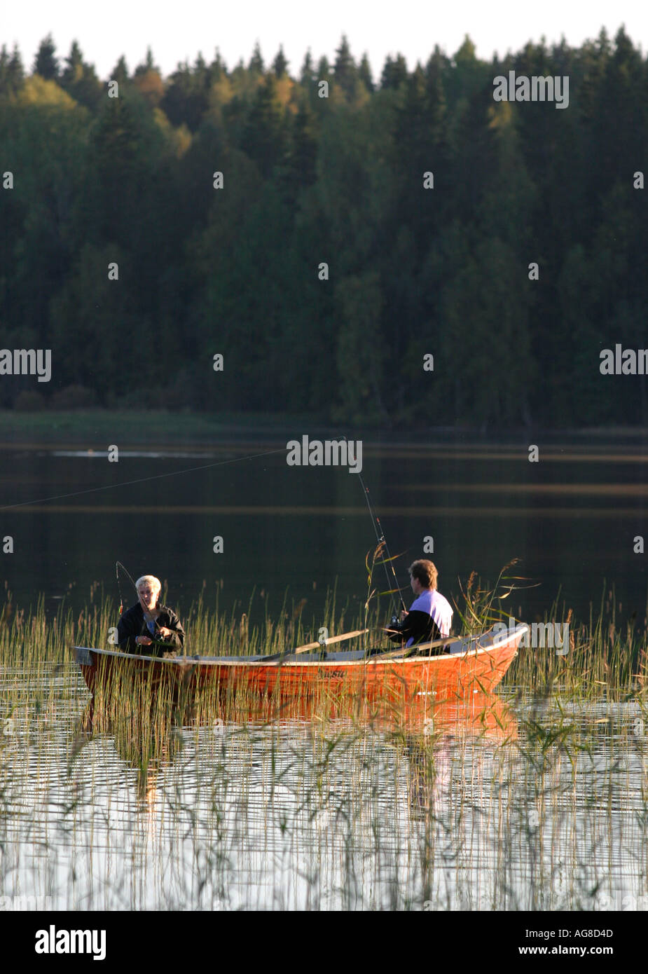 Couple fishing from a boat hi-res stock photography and images - Alamy