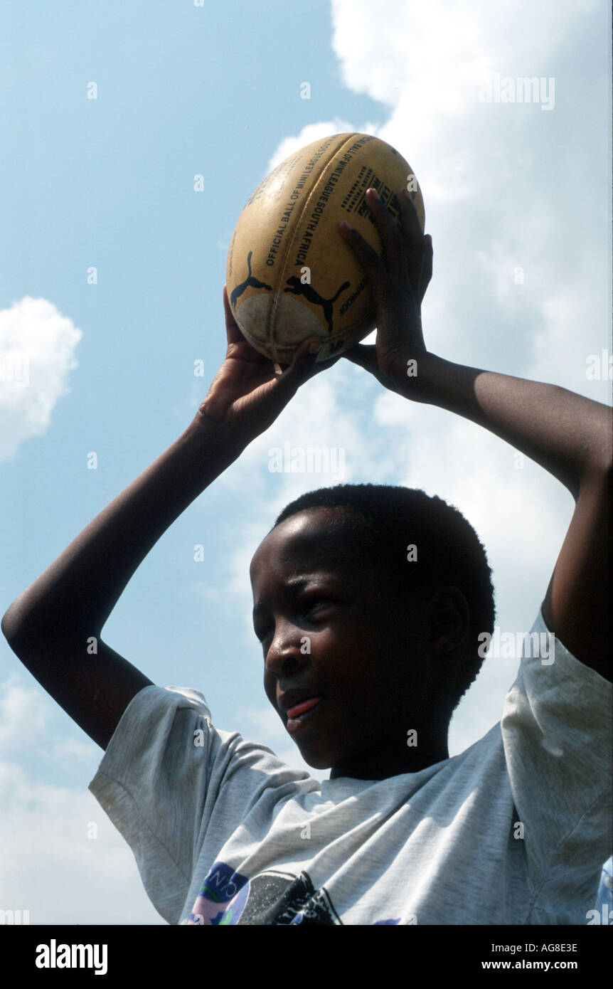 SOUTH AFRICA CHILD PLAYING RUGBY MOOIPLAN EASTERN CAPE Stock Photo - Alamy