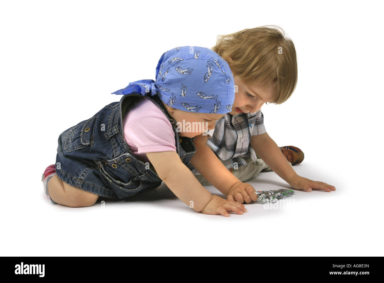 Baby girl kneeling Cut Out Stock Images & Pictures - Alamy