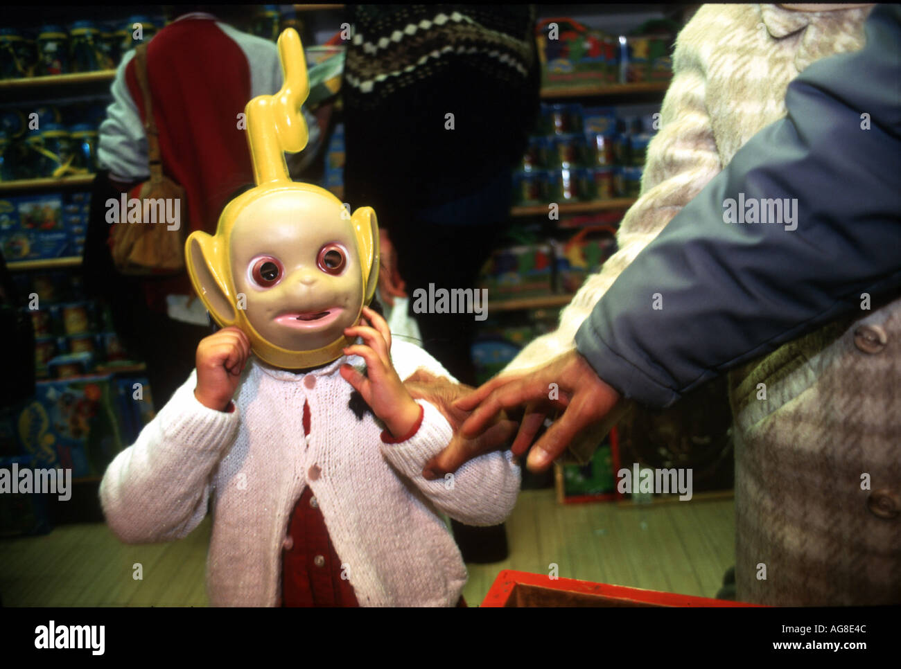 ENGLAND TRYING A TELETUBBY MASK AT HAMLYNS TOY STORE LONDON Photo Julio ...