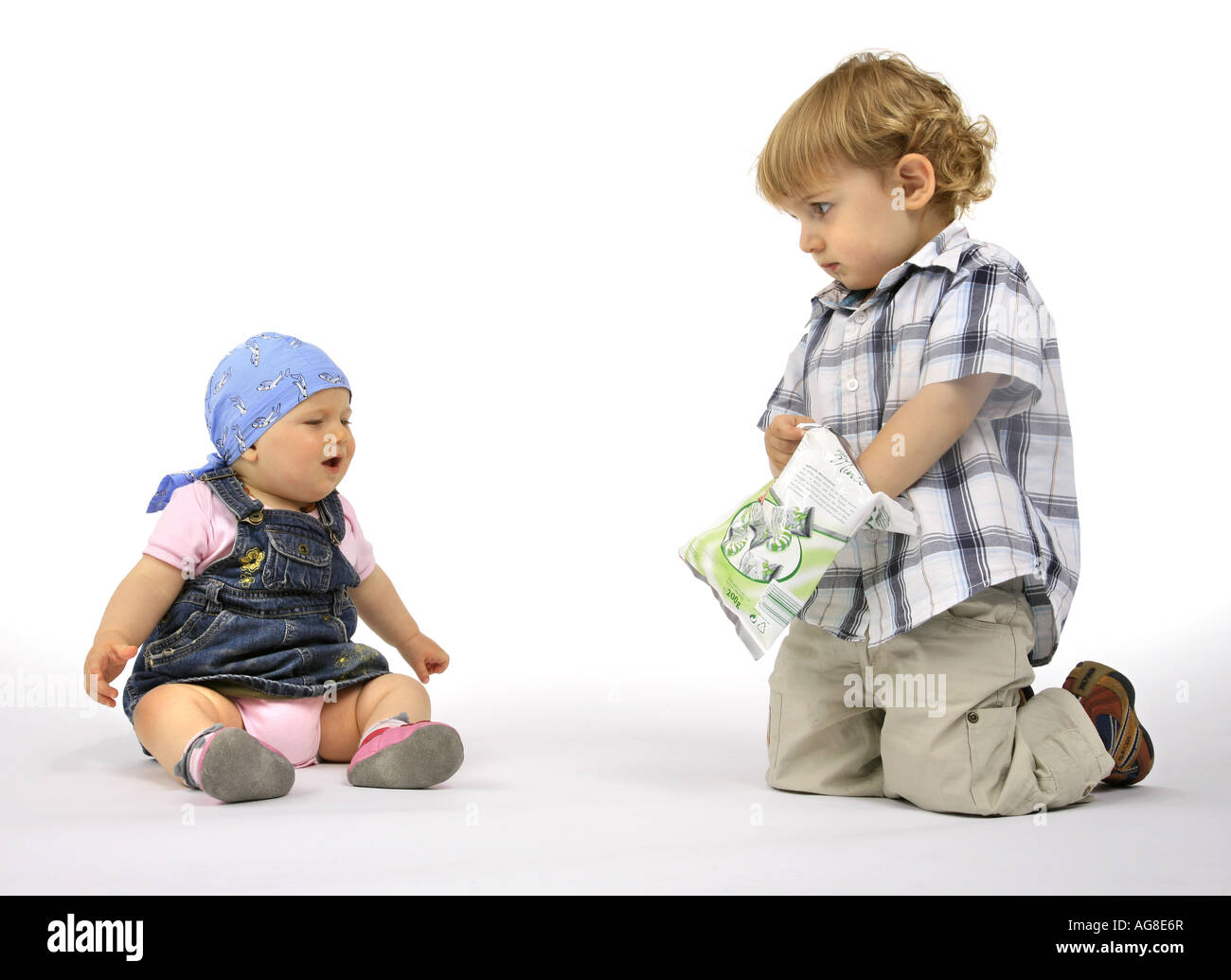 Child sharing sweets hi-res stock photography and images - Alamy