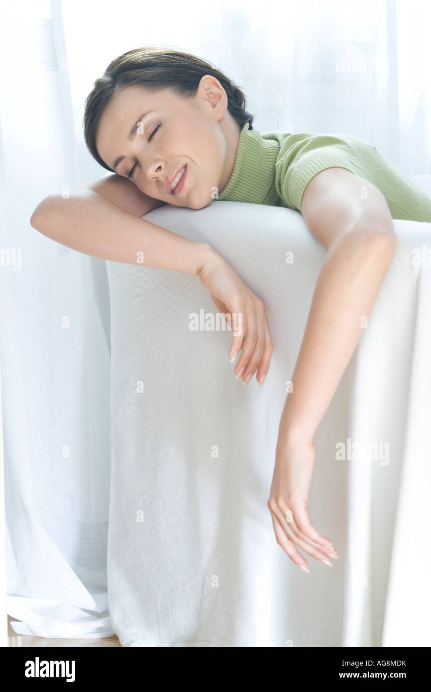 woman relaxing on sofa Stock Photo - Alamy