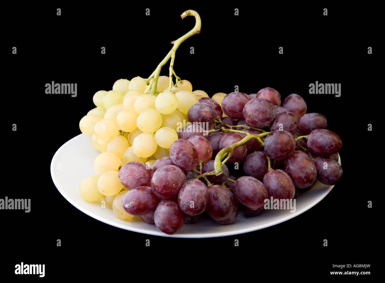 Bunch of grapes on a plate Stock Photo - Alamy