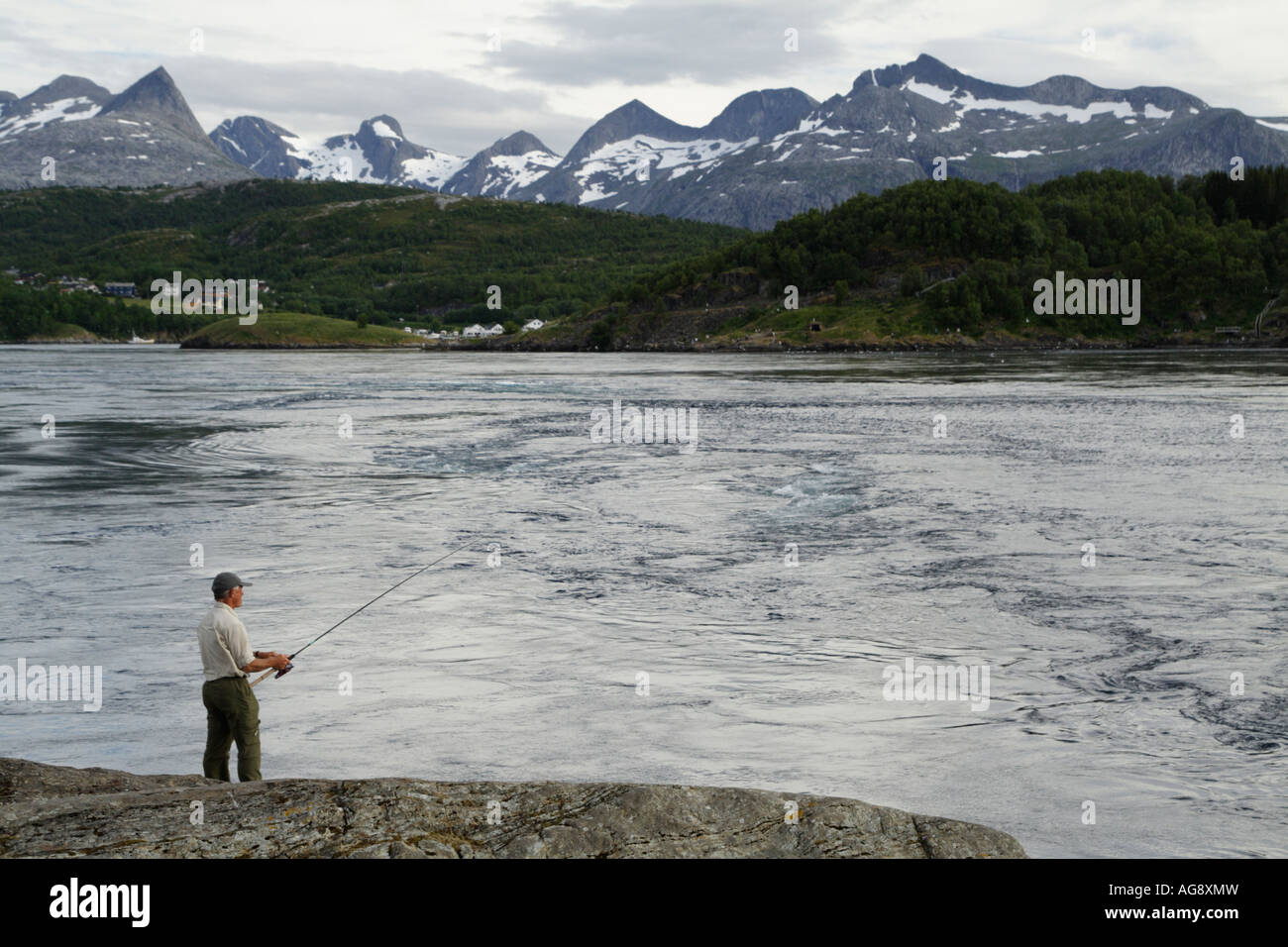 Man is fishing at Saltstraumen tidal current, near Bodø, Norway Stock ...