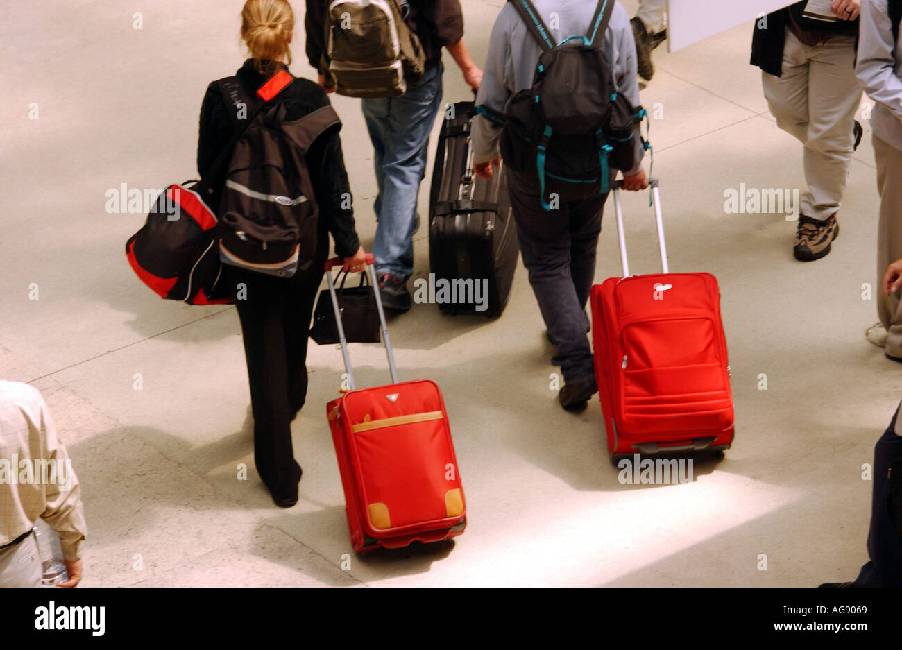 People Pulling Suitcases Stock Photo - Alamy