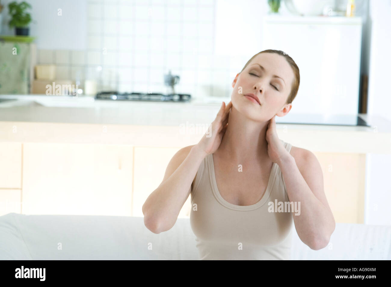 woman massaging neck Stock Photo - Alamy