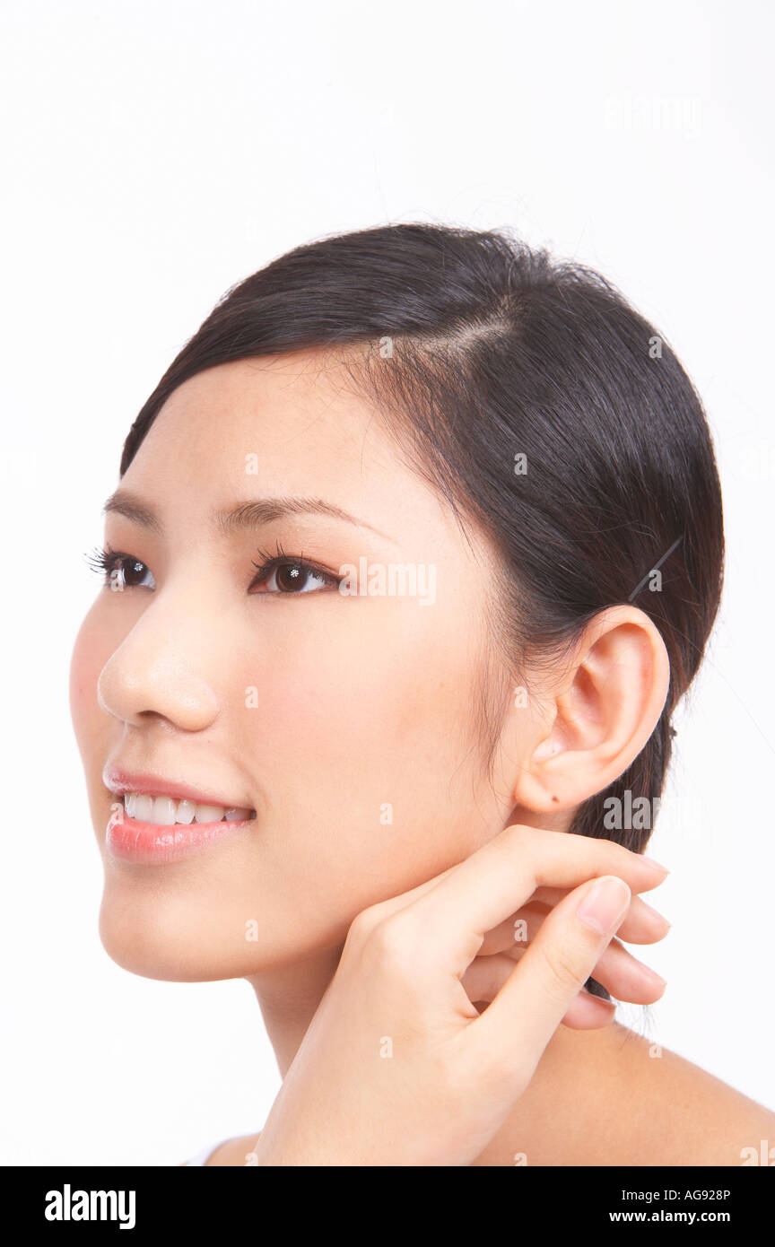Portrait of Natural Young girl with hands next to face Stock Photo - Alamy