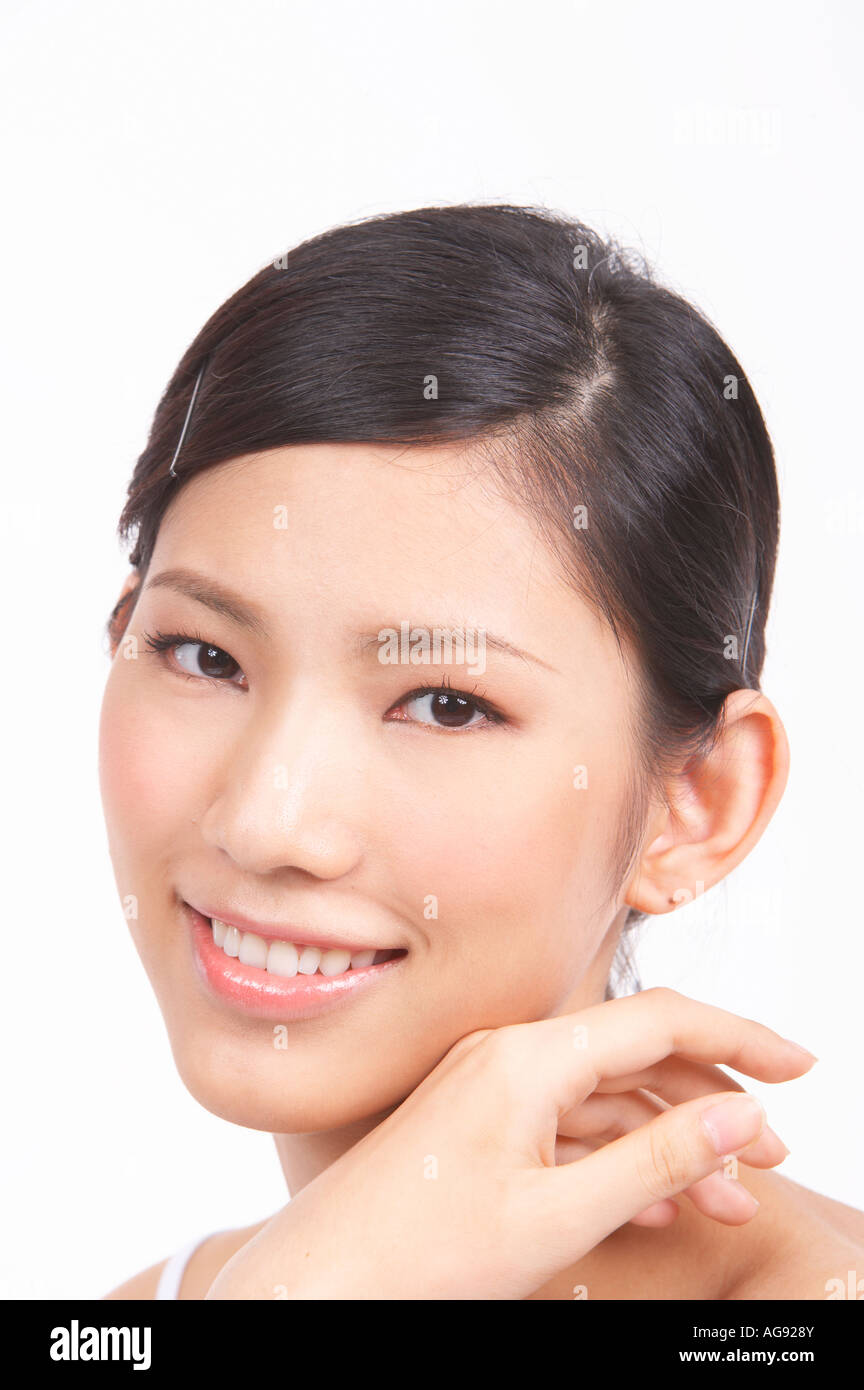 Portrait of Natural Young girl with hands next to face Stock Photo - Alamy