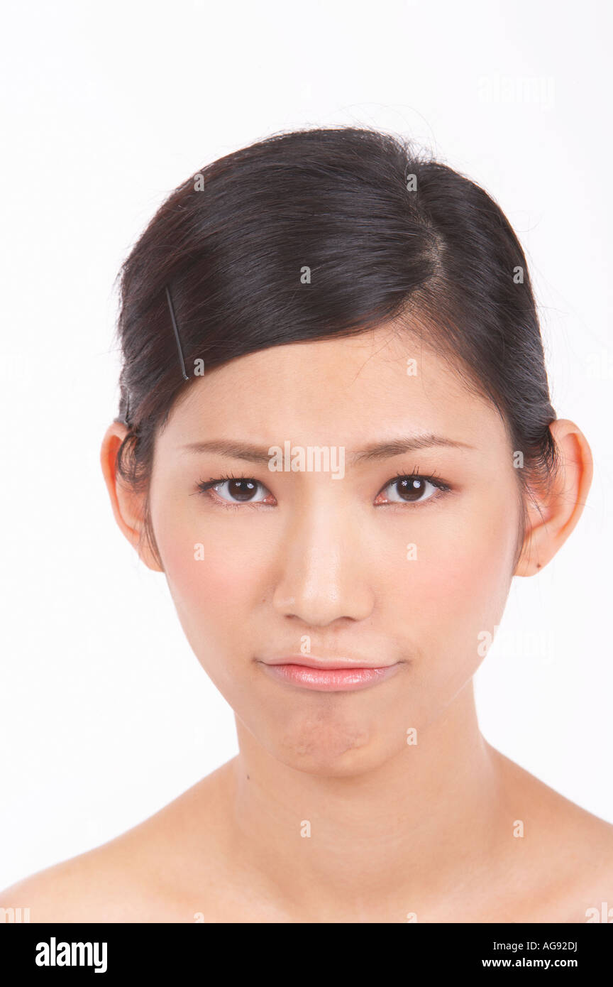 Portrait of Natural Young girl pulling facial expression Stock Photo ...