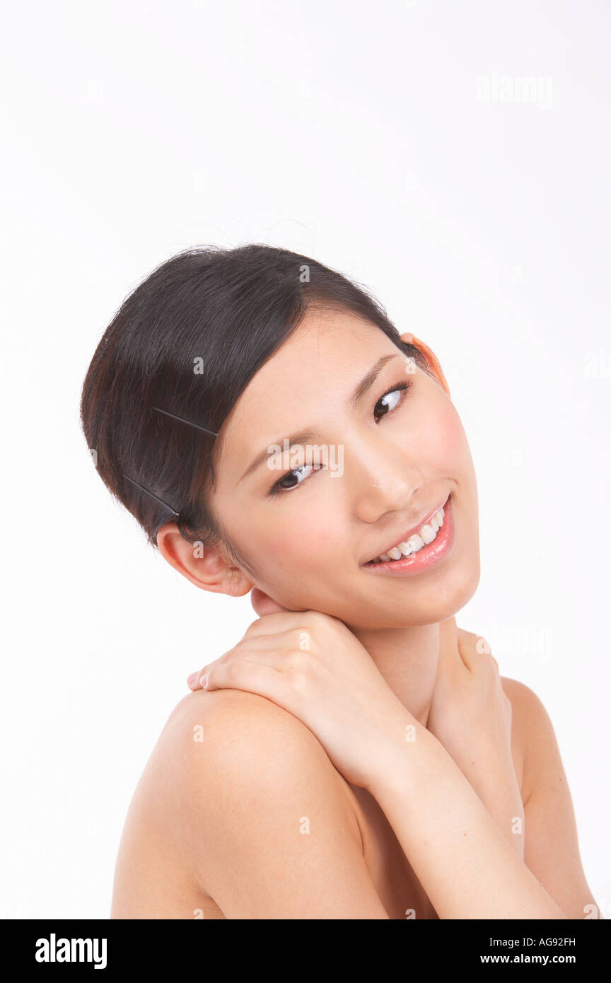 Portrait of Natural Young girl touching shoulder Stock Photo - Alamy