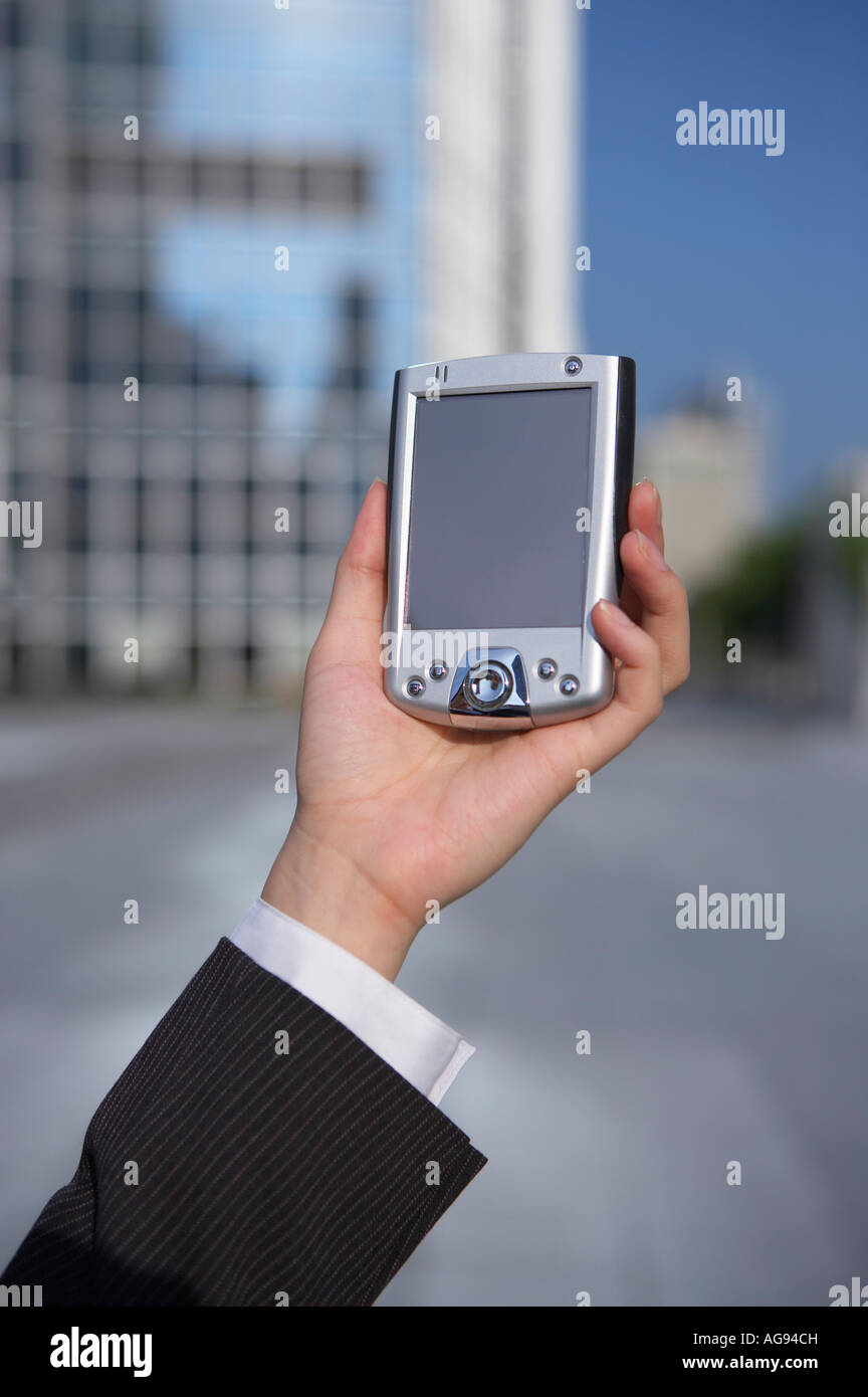 Close-Up of a Woman's Hand Holding a PDA Stock Photo - Alamy