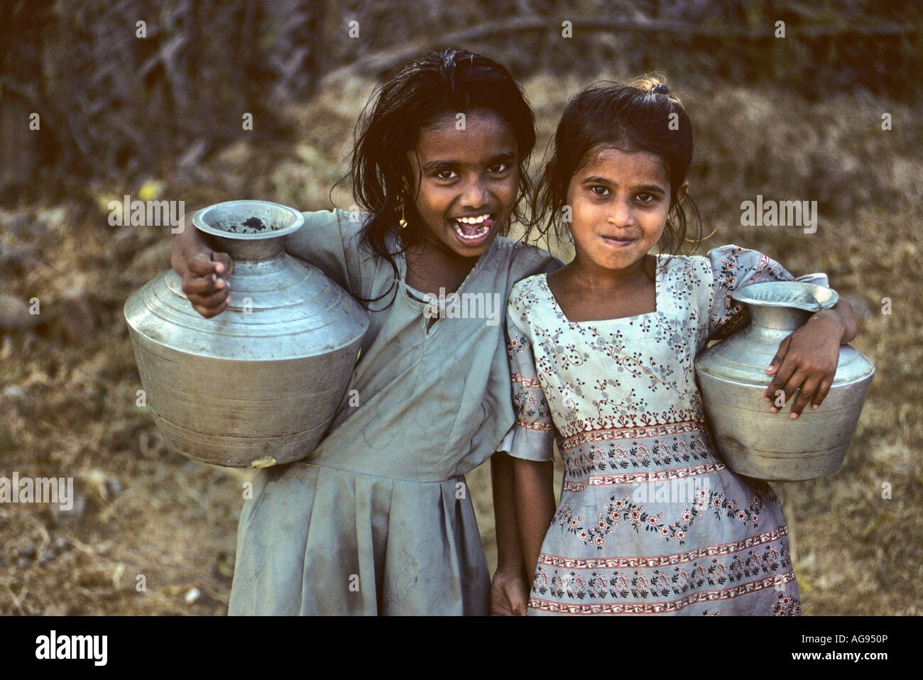 Sri Lanka Polonnaruwa, Girls carrying water buckets Stock Photo - Alamy