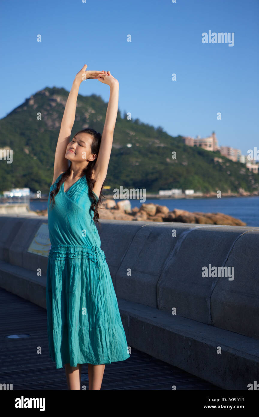 Young Lady Stretching, Eyes Closed Stock Photo - Alamy