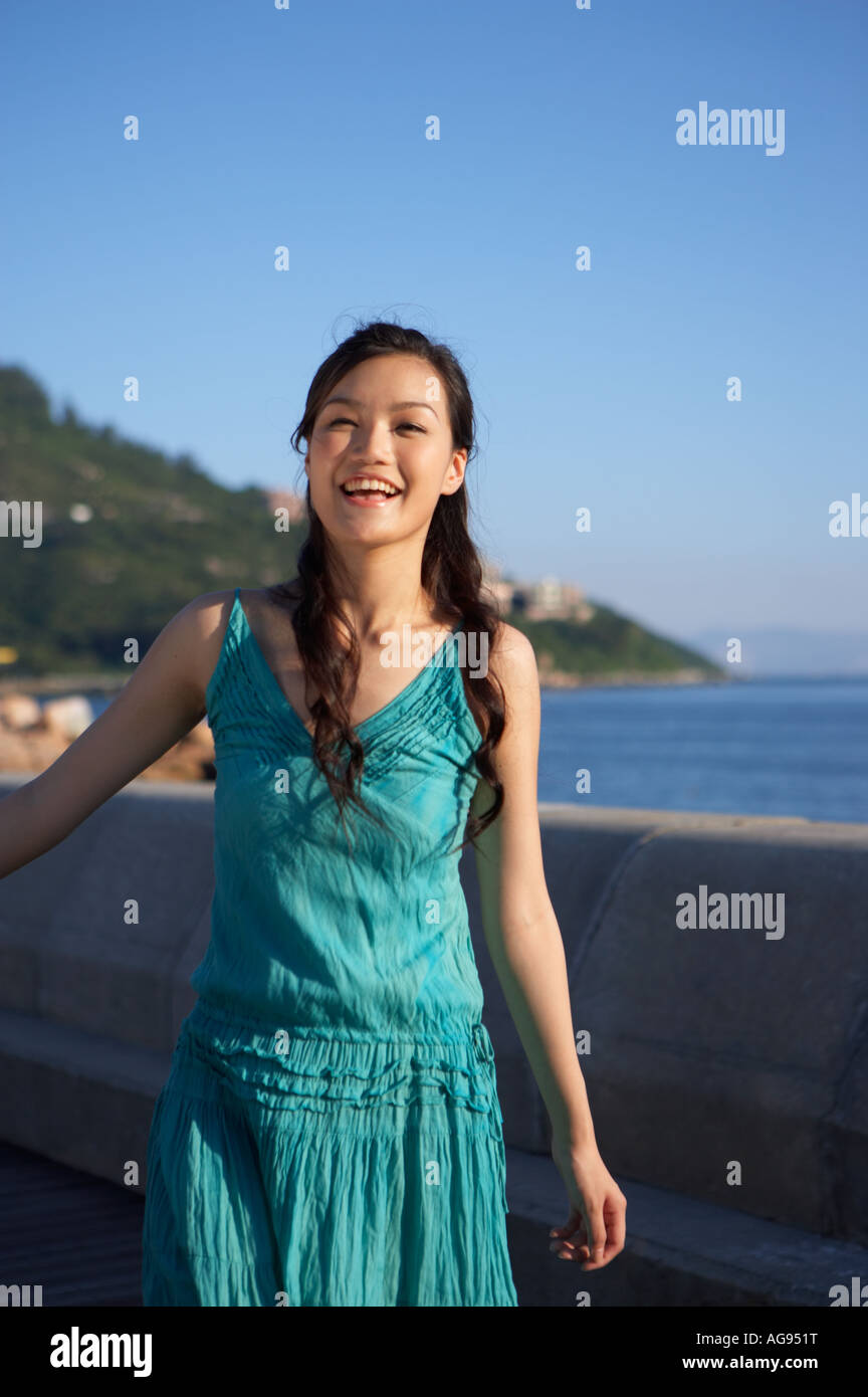 Young Lady Walking along Promenade Stock Photo - Alamy