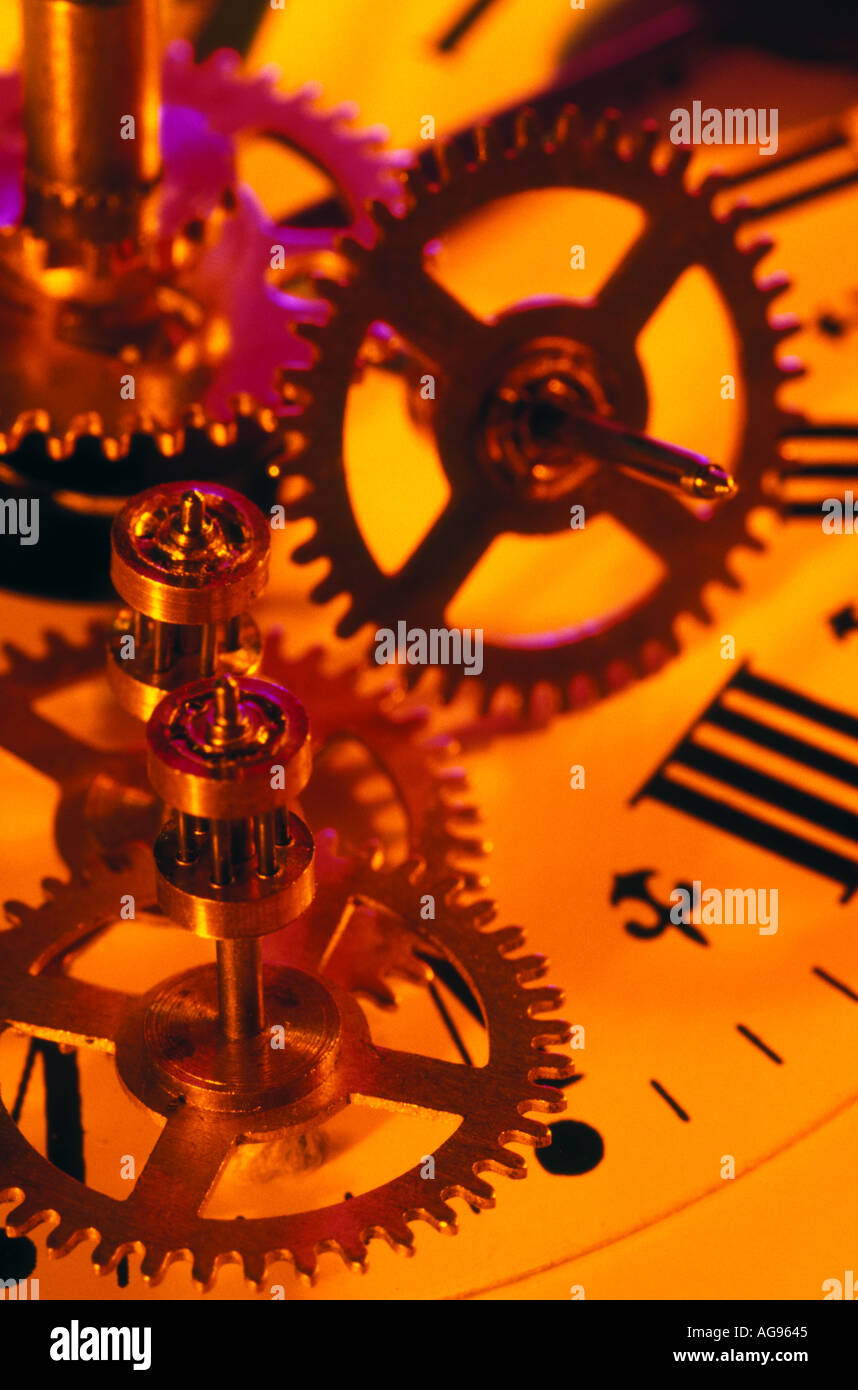 Clockwork gear wheels and clock face Stock Photo - Alamy