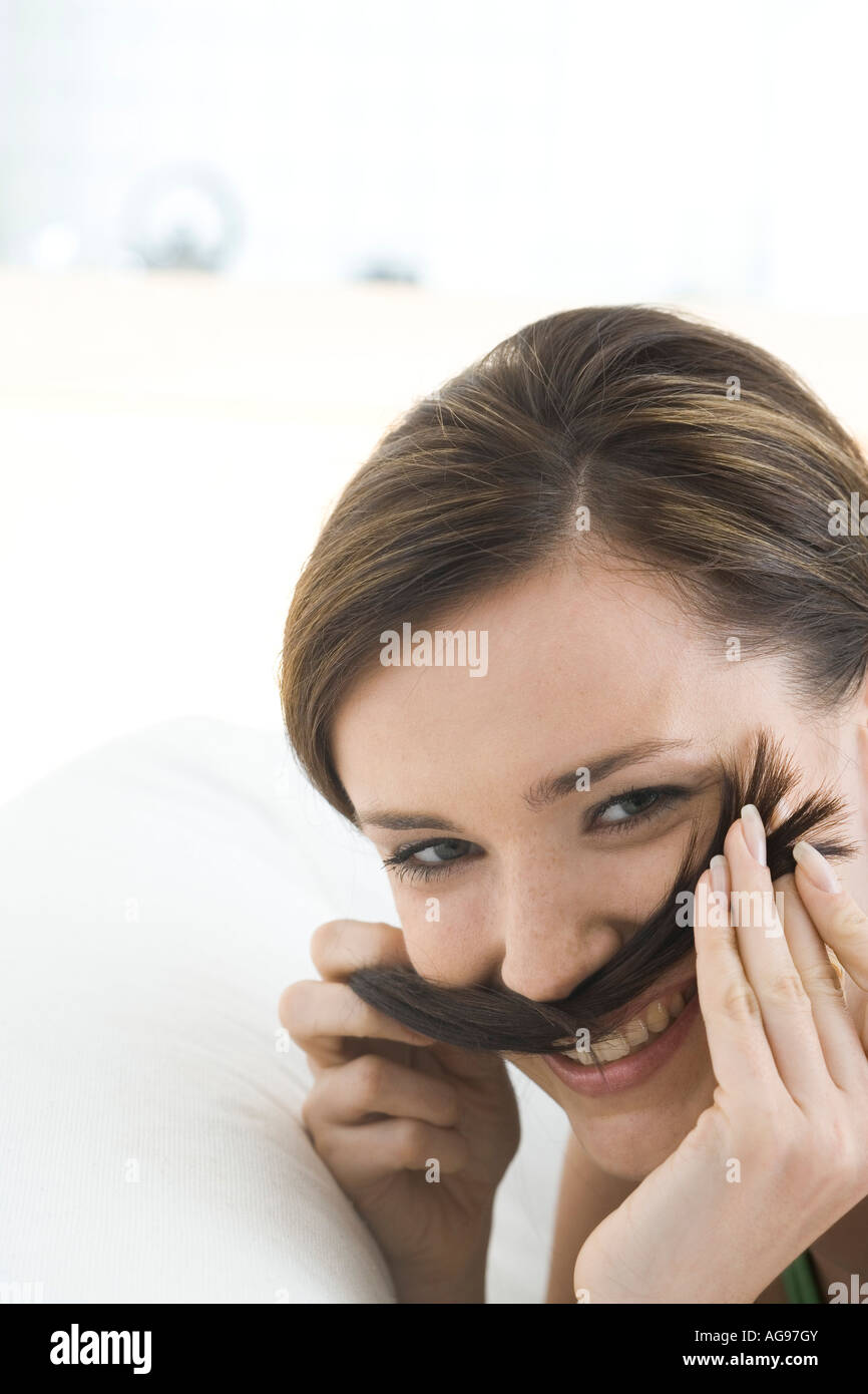 woman playing with hair Stock Photo - Alamy