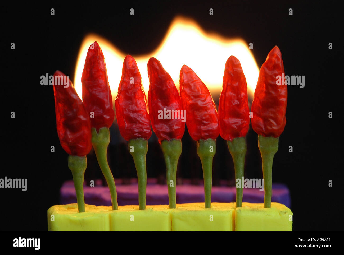 Peppers literally on fire Stock Photo - Alamy