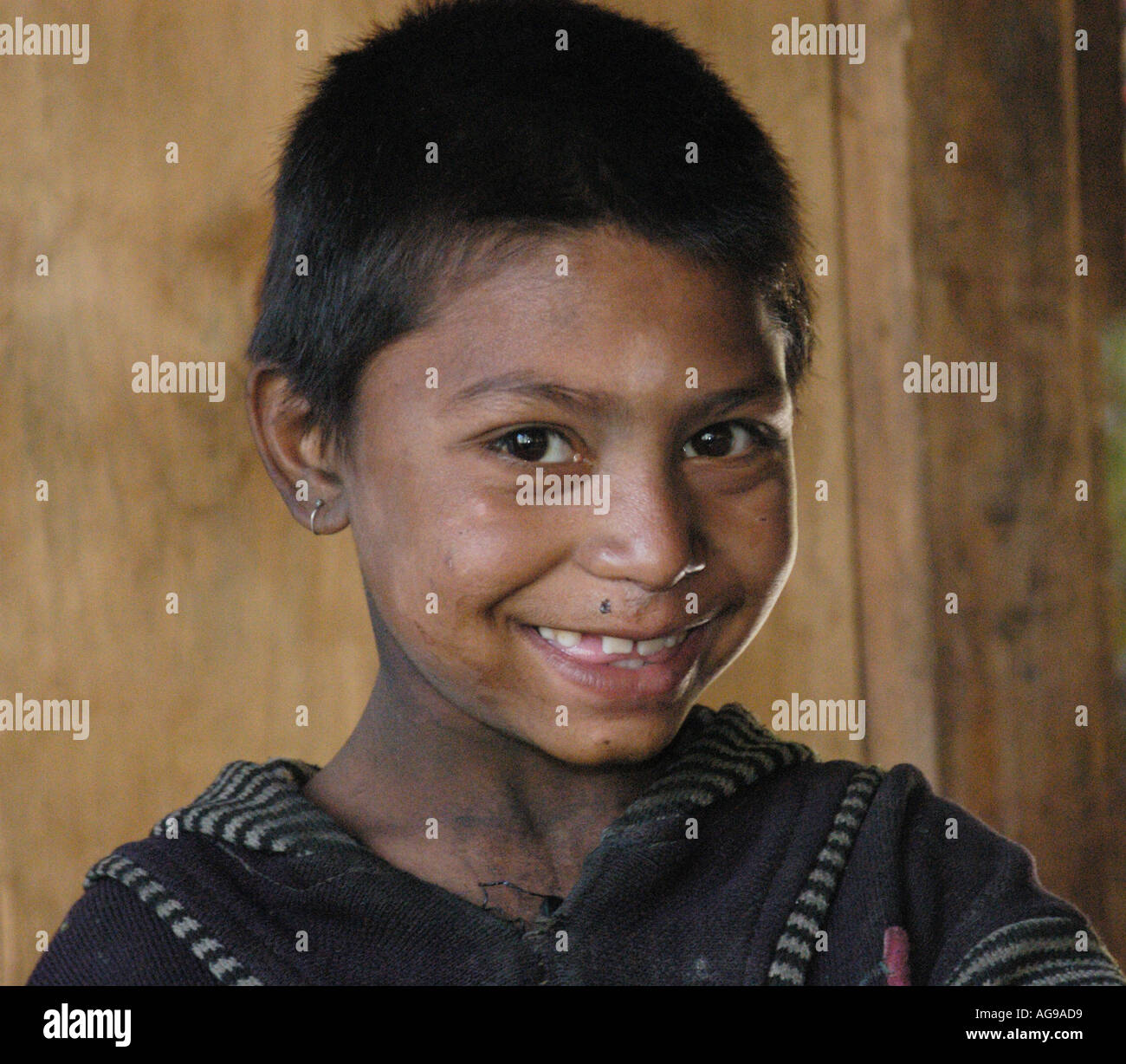 Smiling Nepali boy with a dirty neck Stock Photo - Alamy
