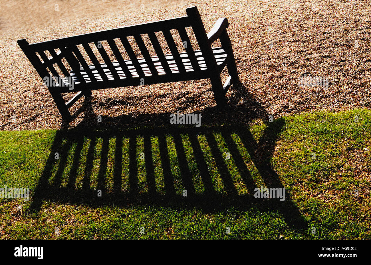 park bench with shadows Stock Photo - Alamy