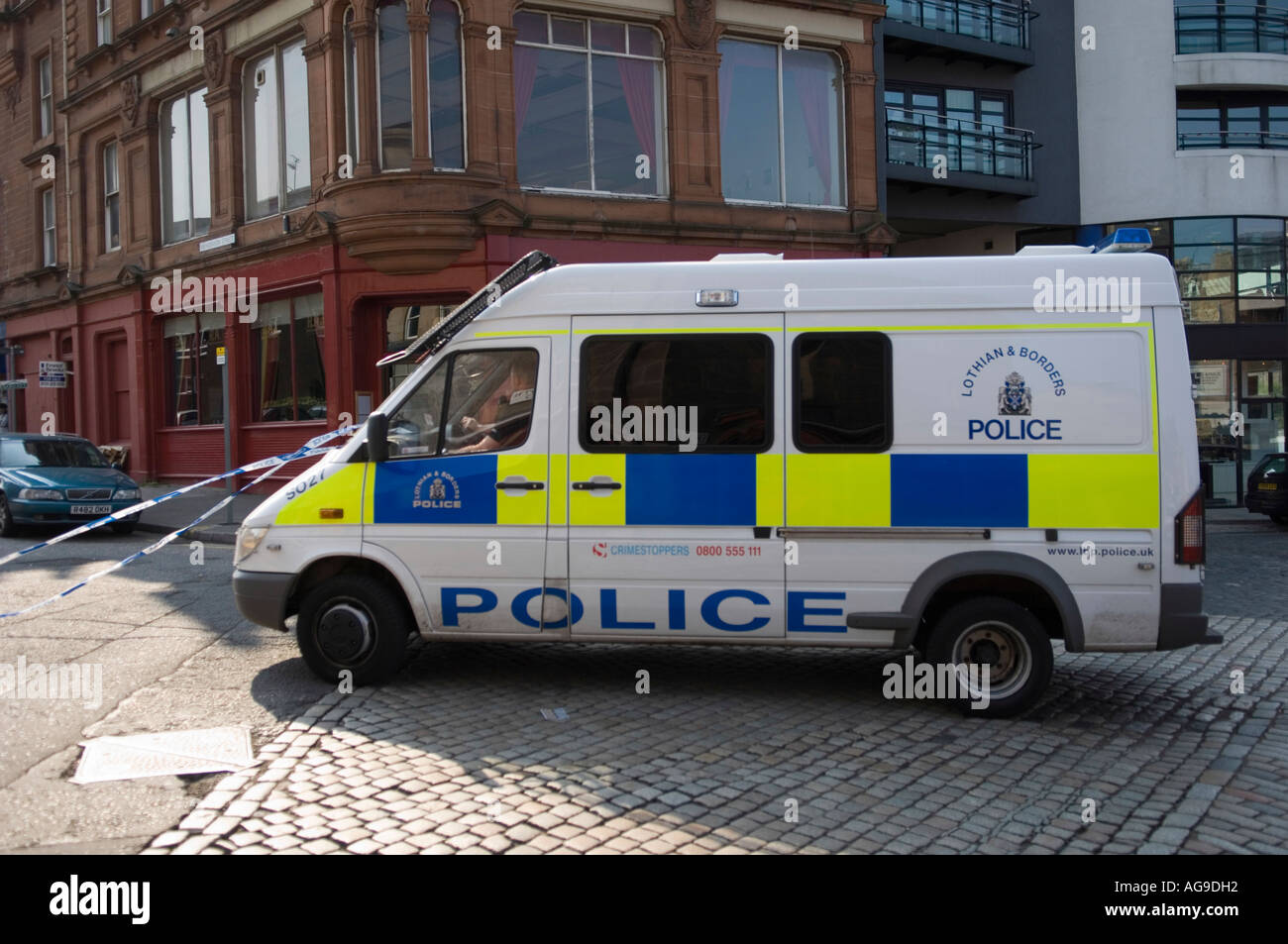 Lothian and Borders Police van outside a sealed-off residential area ...