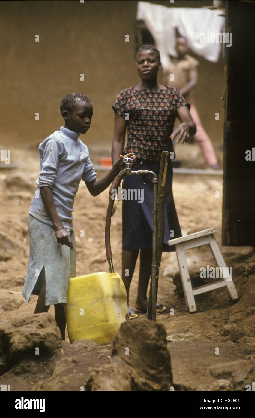 Collecting water from a standpipe set up by a development agency in ...