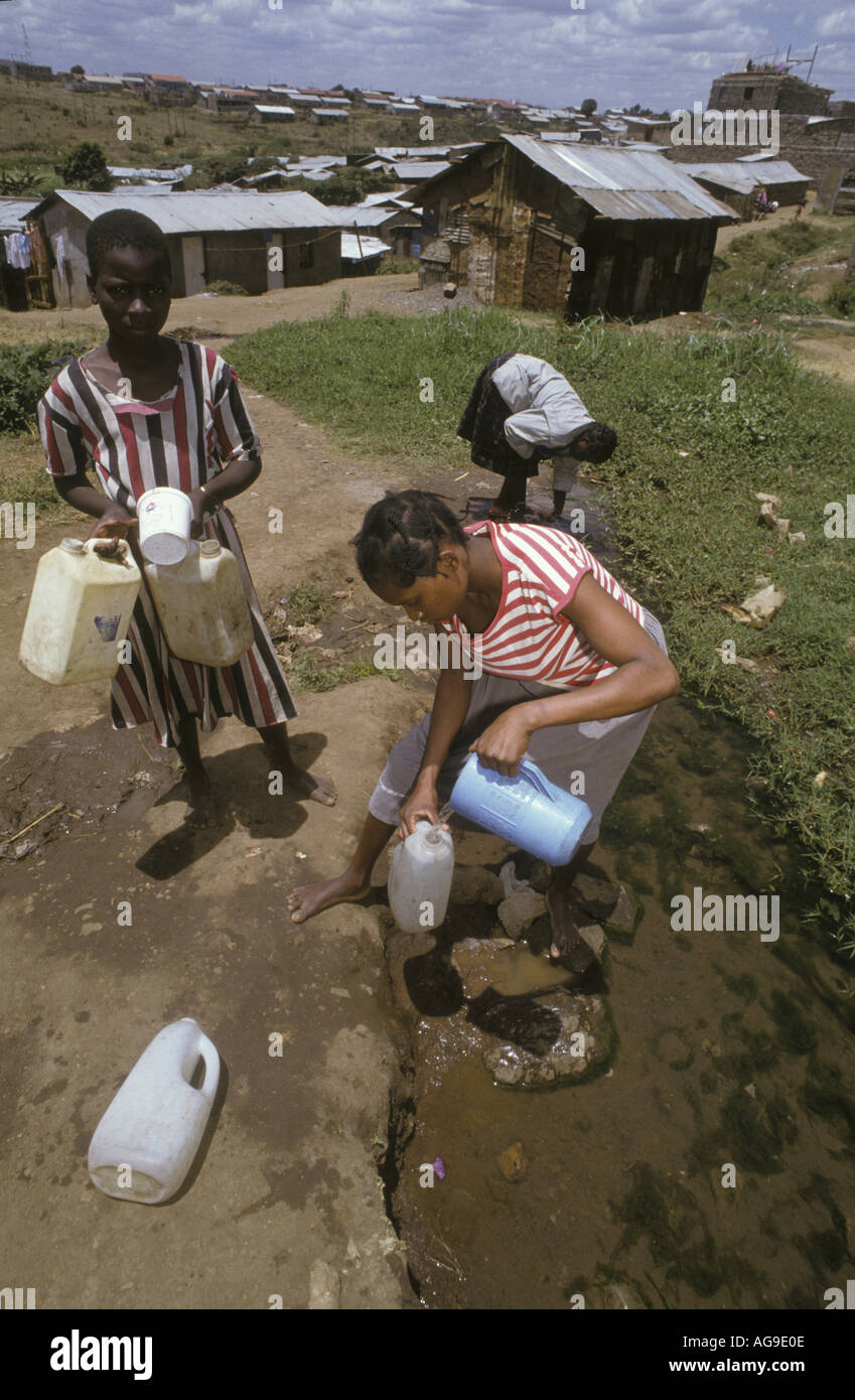 Collecting water from filthy infected water in Kibera Shanty in Nairobi ...