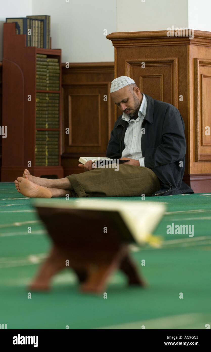 Muslim man reading the Quran in a mosque Stock Photo - Alamy