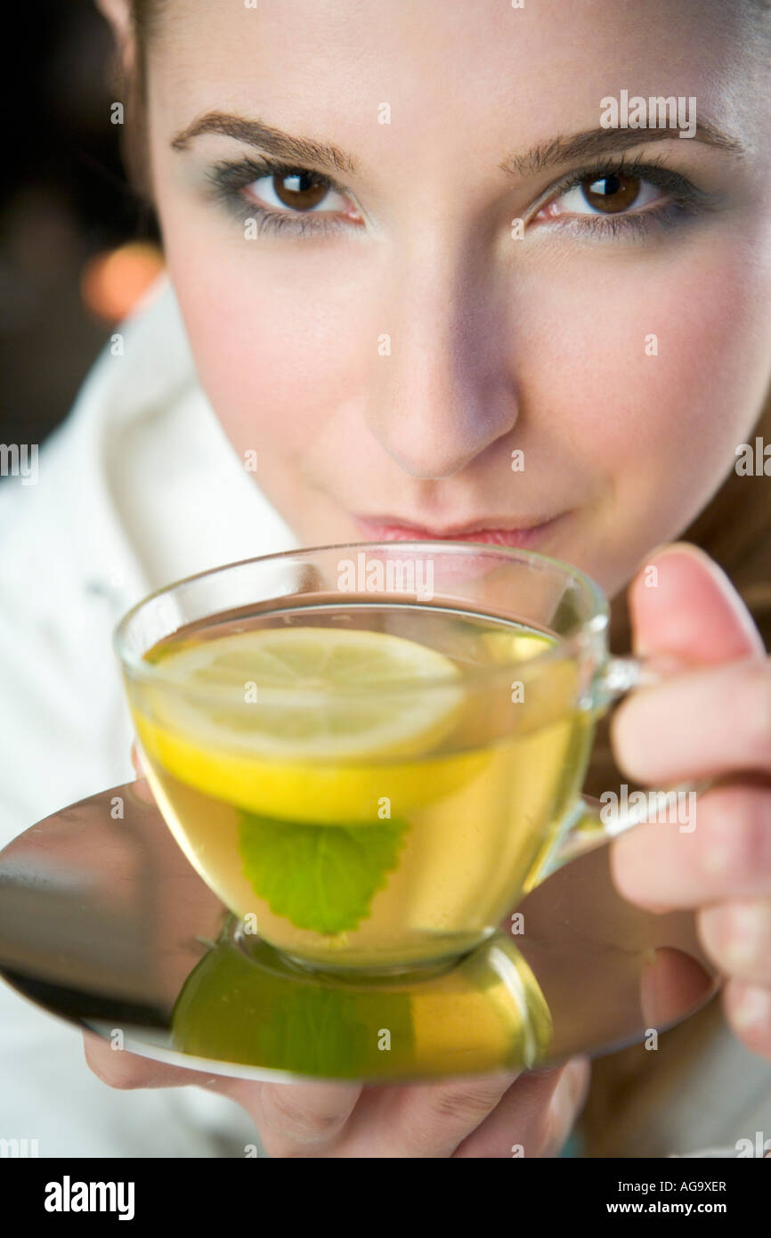 woman drinking lemon tea Stock Photo - Alamy