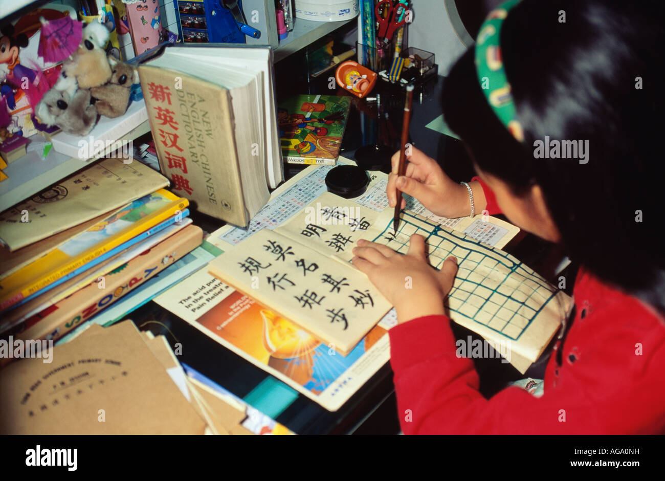 China, Hong Kong, Girl learning to write Chinese Stock Photo - Alamy