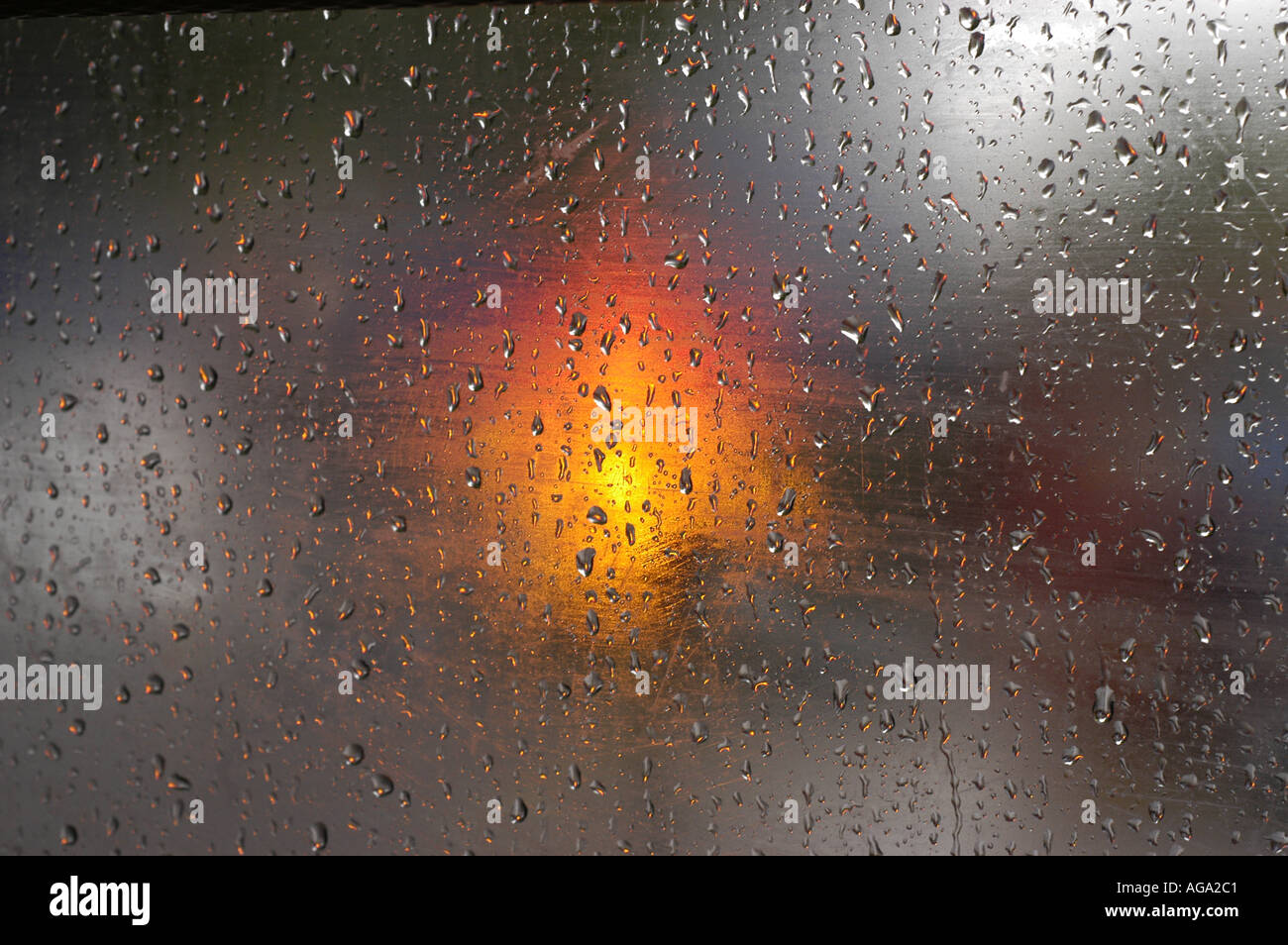 Traffic light through a bus window in the rain London November 2003 ...