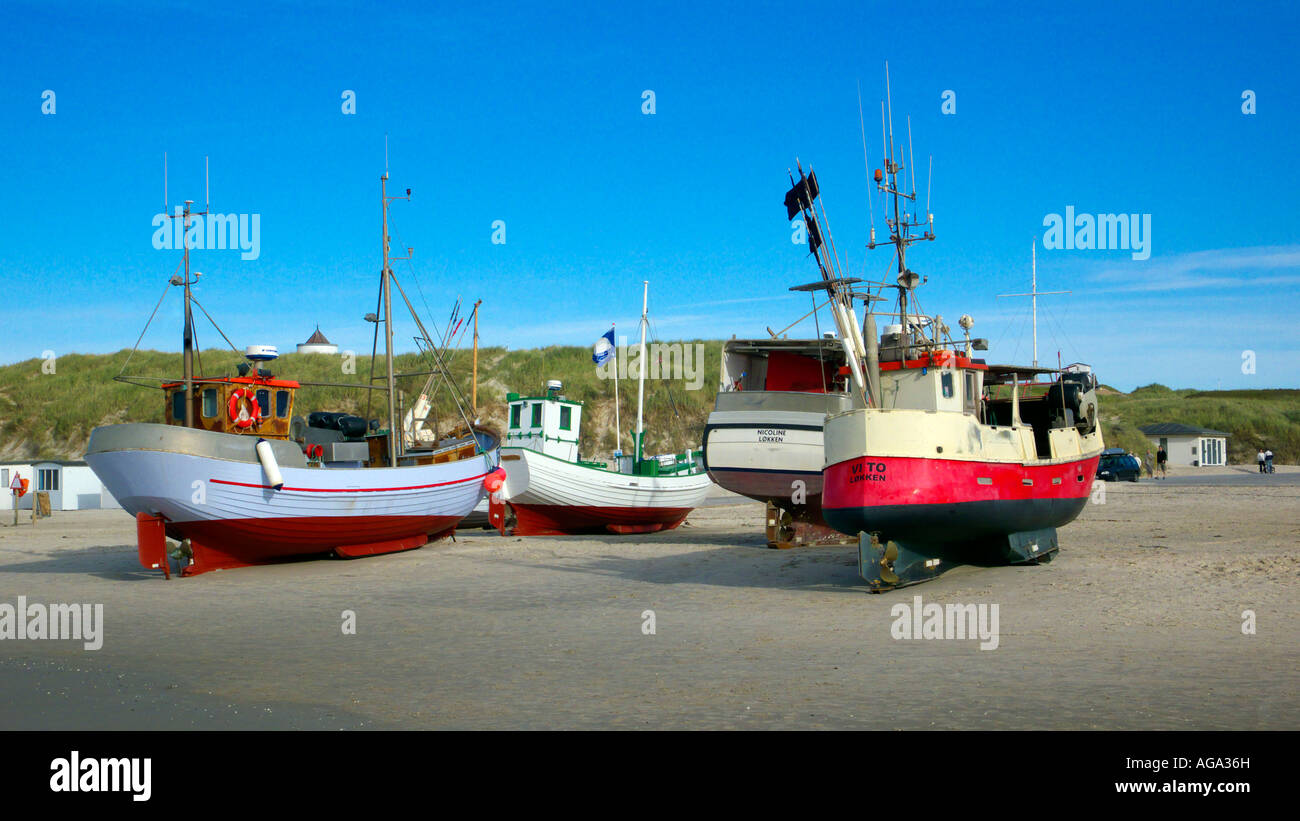 A lineup of four small Danish Fishing boats beached at Lokken in ...