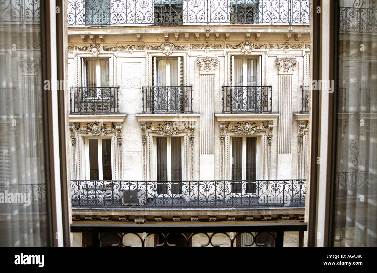 Windows across the road from a hotel in Paris Stock Photo - Alamy