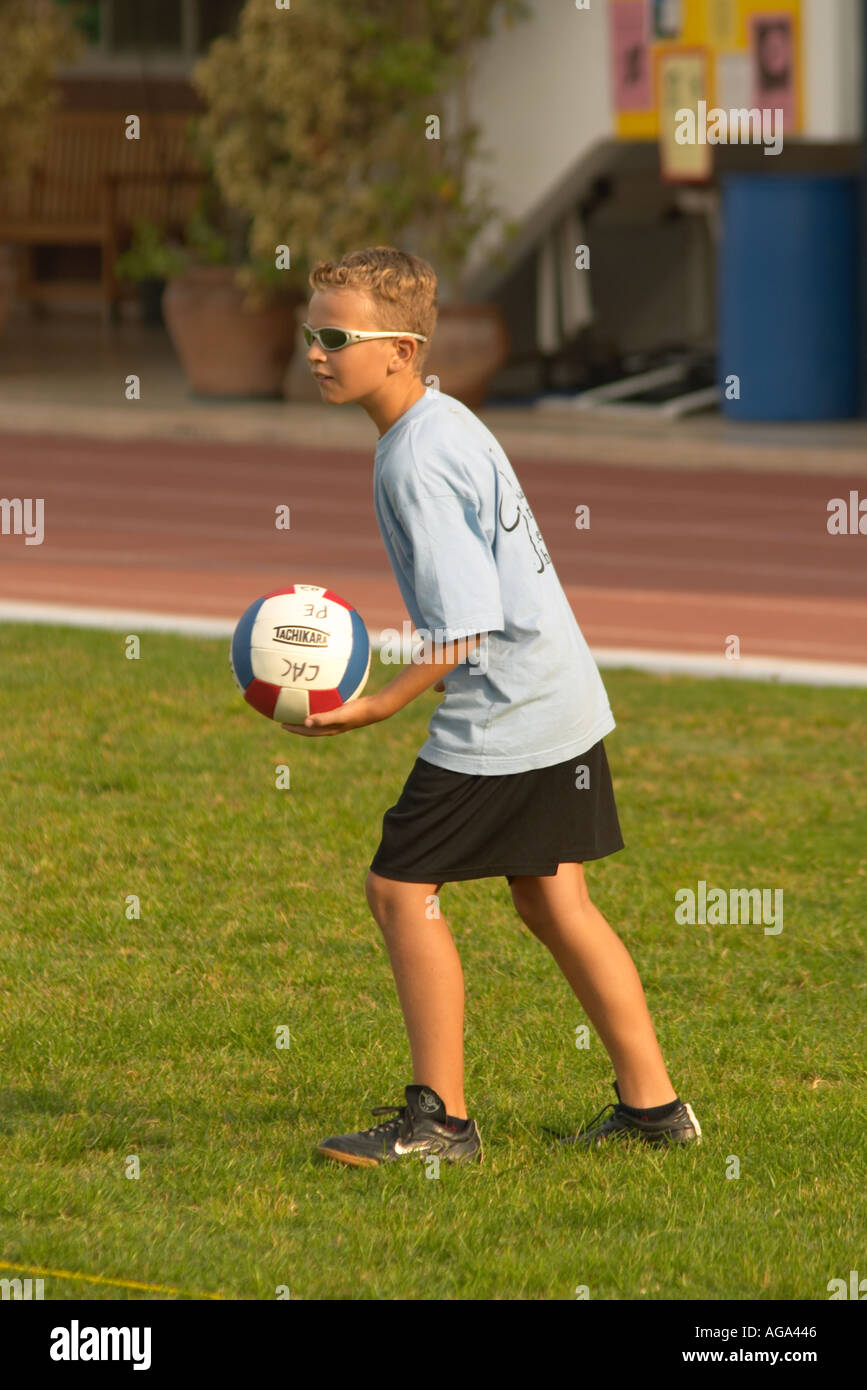 school boy playing volleyball Stock Photo - Alamy