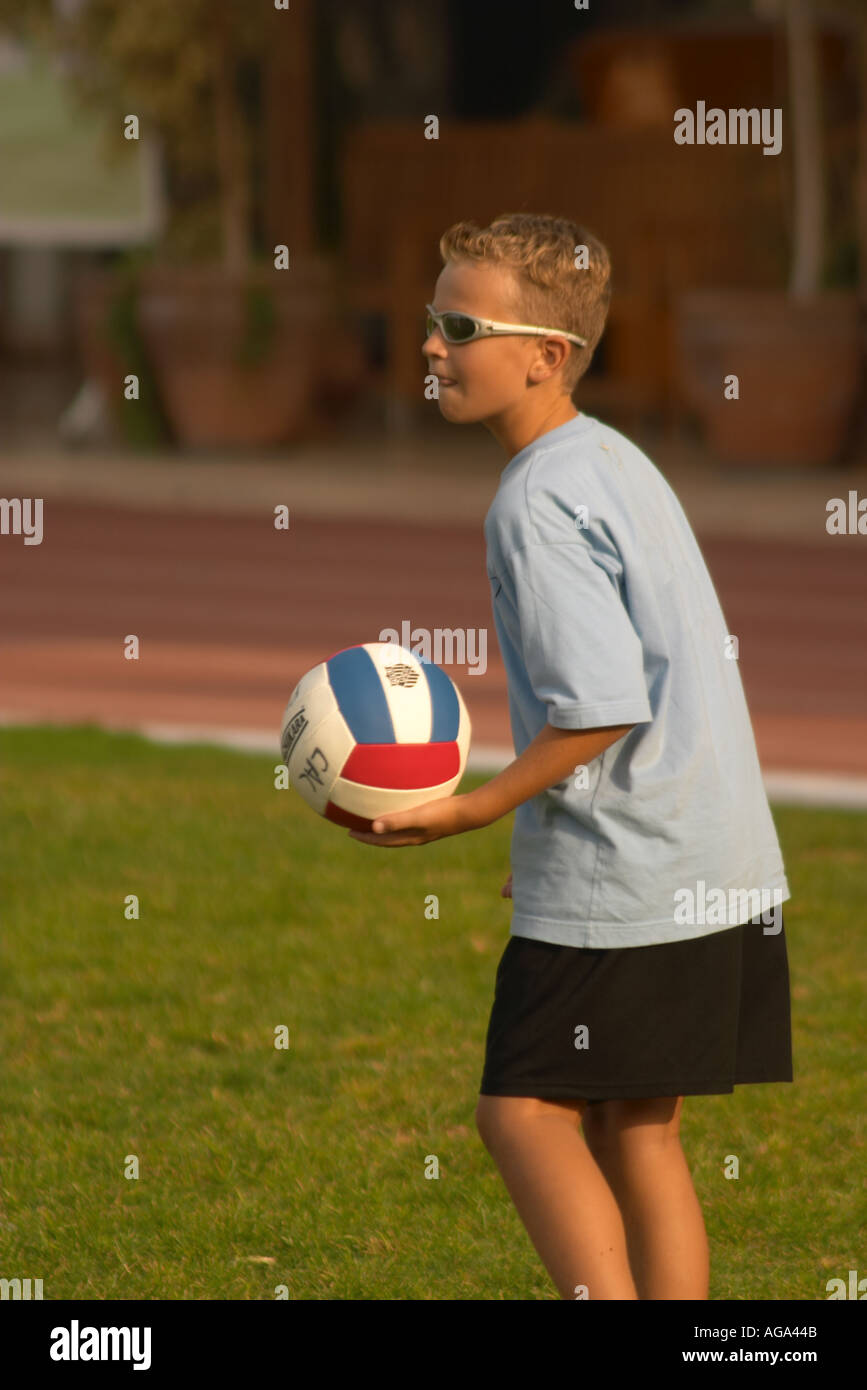 school boy playing volleyball Stock Photo - Alamy