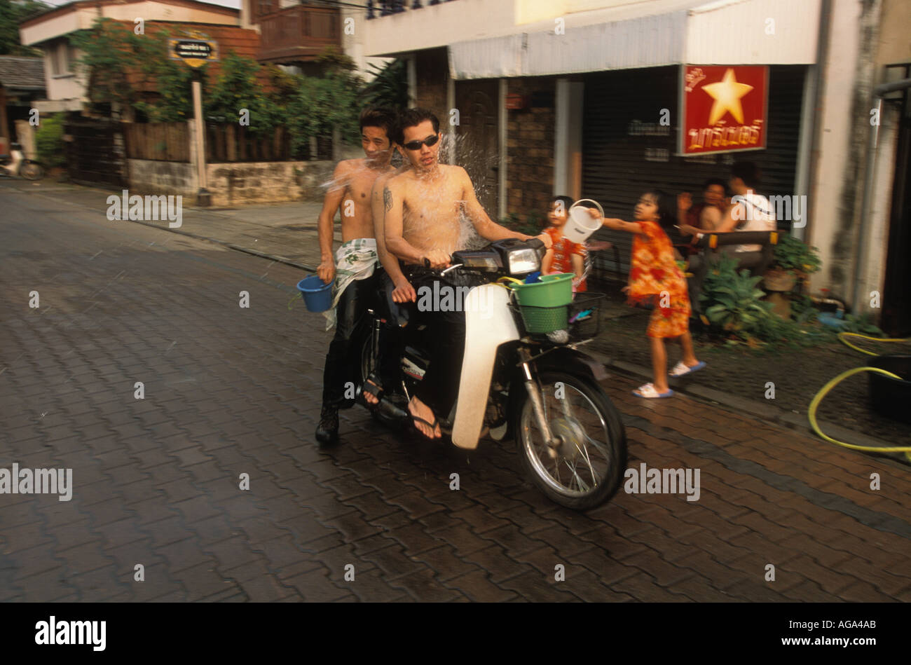 Three girls on a motor bike hi-res stock photography and images - Alamy